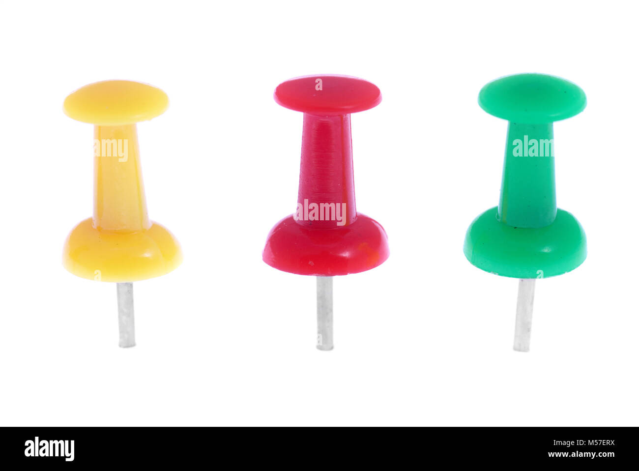 Three colored pins Stock Photo - Alamy