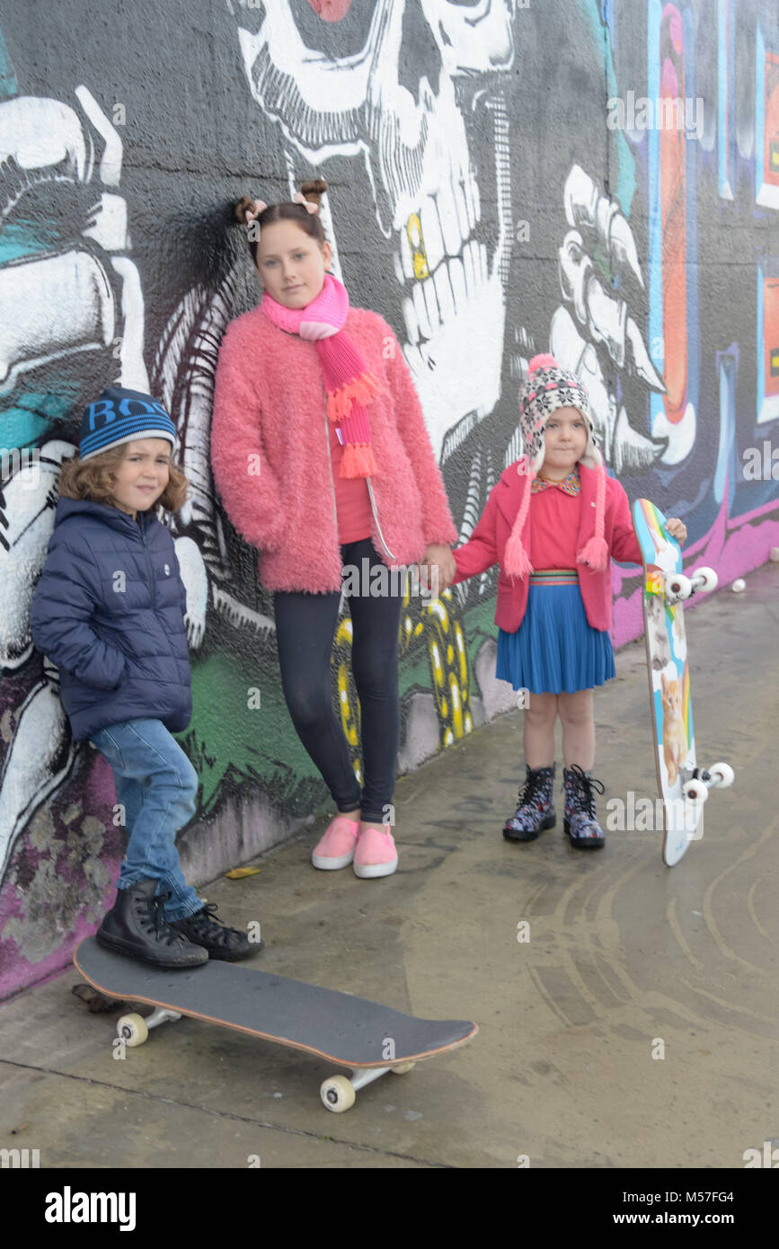 young kids are having fun at a skatepark Stock Photo - Alamy