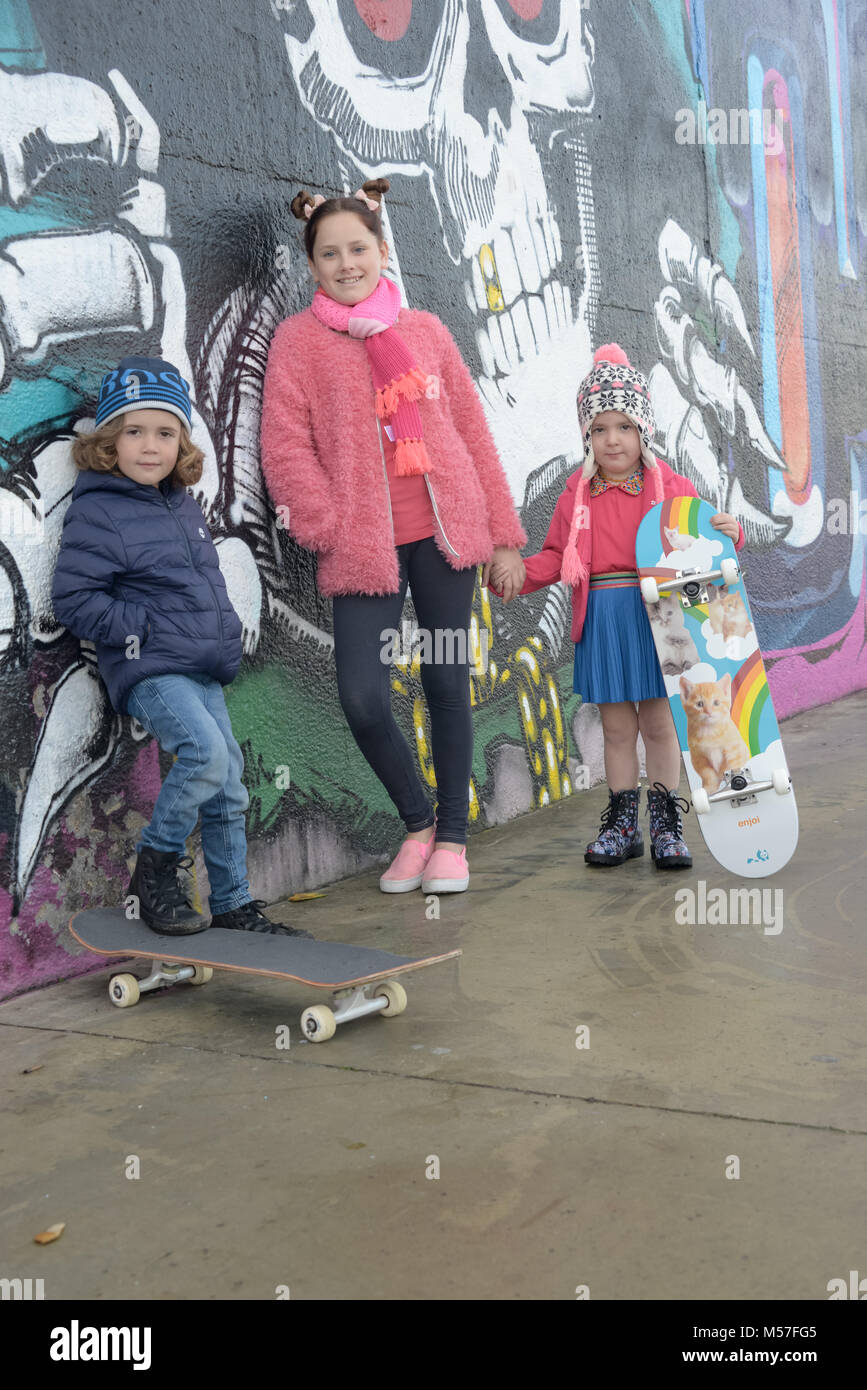 young kids are having fun at a skatepark Stock Photo - Alamy