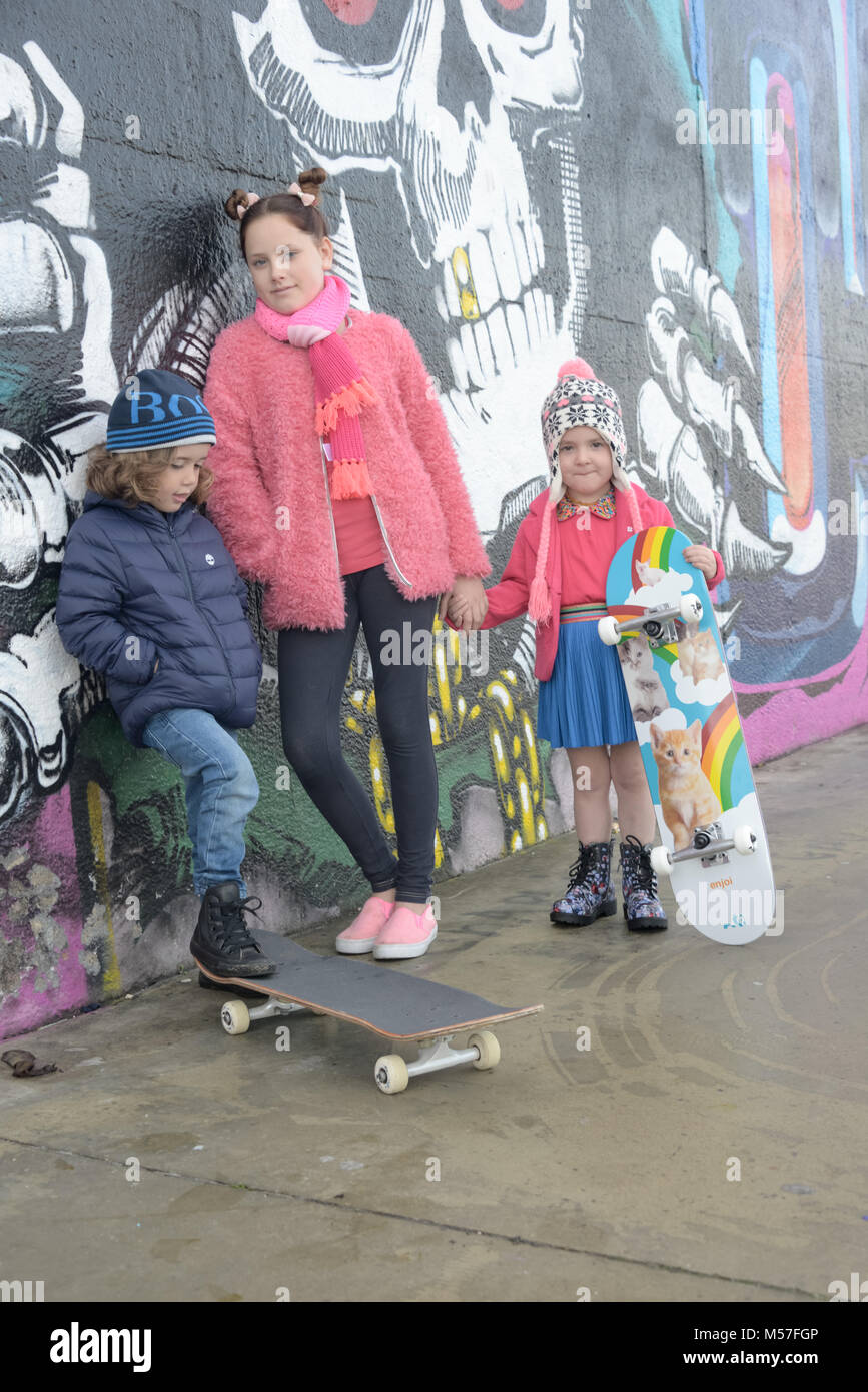 young kids are having fun at a skatepark Stock Photo - Alamy