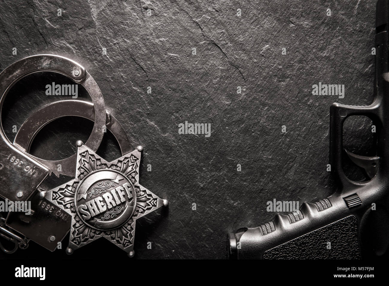 Police badge handcuffs hi-res stock photography and images - Alamy
