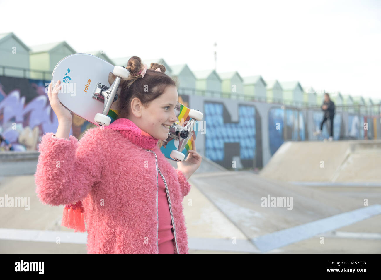 young kids are having fun at a skatepark Stock Photo - Alamy