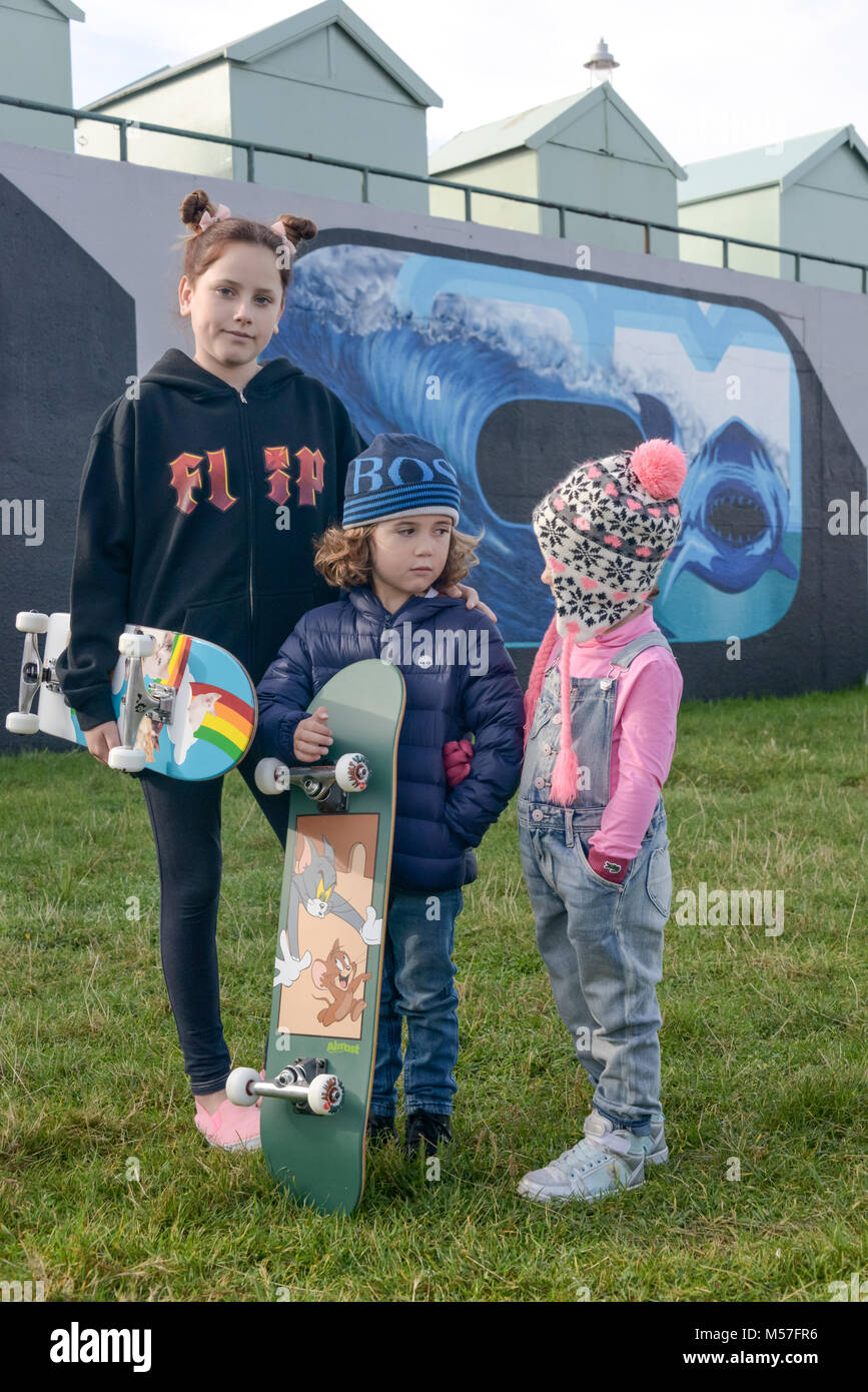 young kids are having fun at a skatepark Stock Photo - Alamy