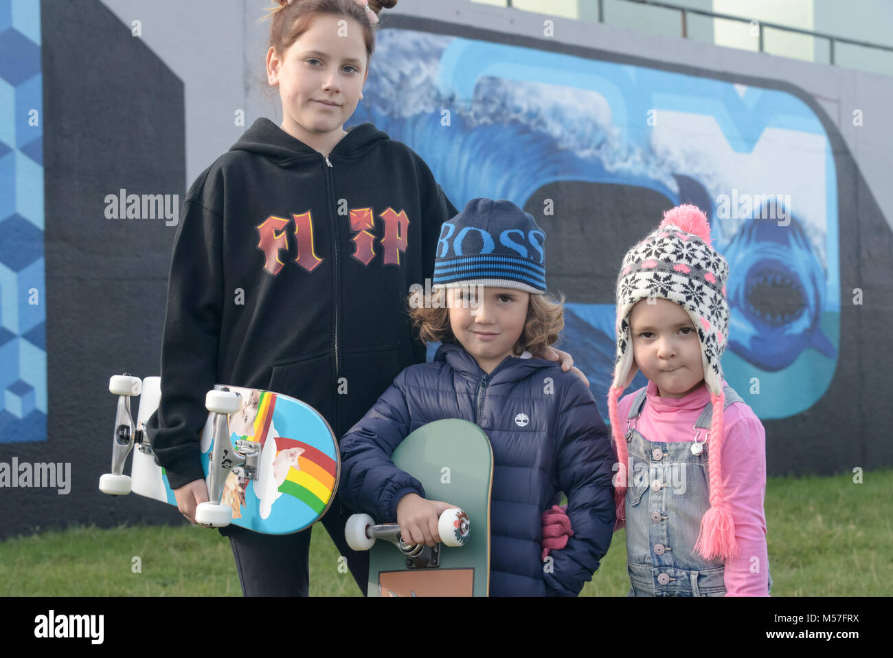 young kids are having fun at a skatepark Stock Photo - Alamy