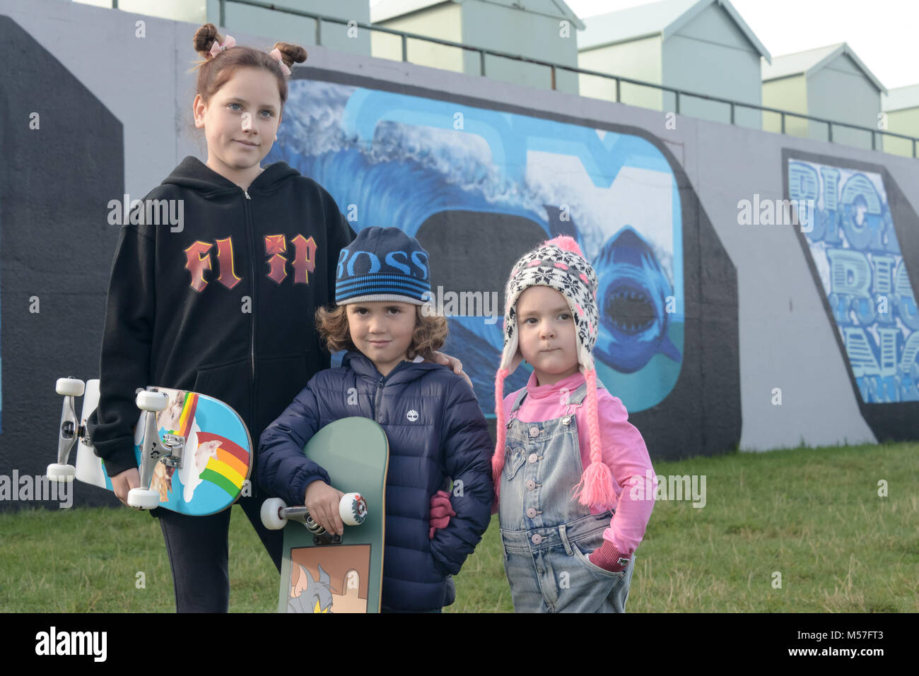 young kids are having fun at a skatepark Stock Photo - Alamy