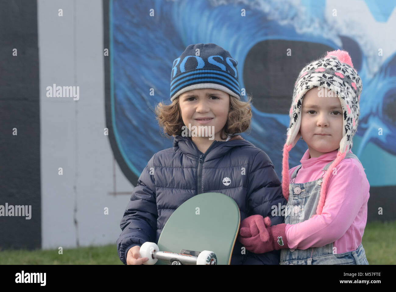 young kids are having fun at a skatepark Stock Photo - Alamy