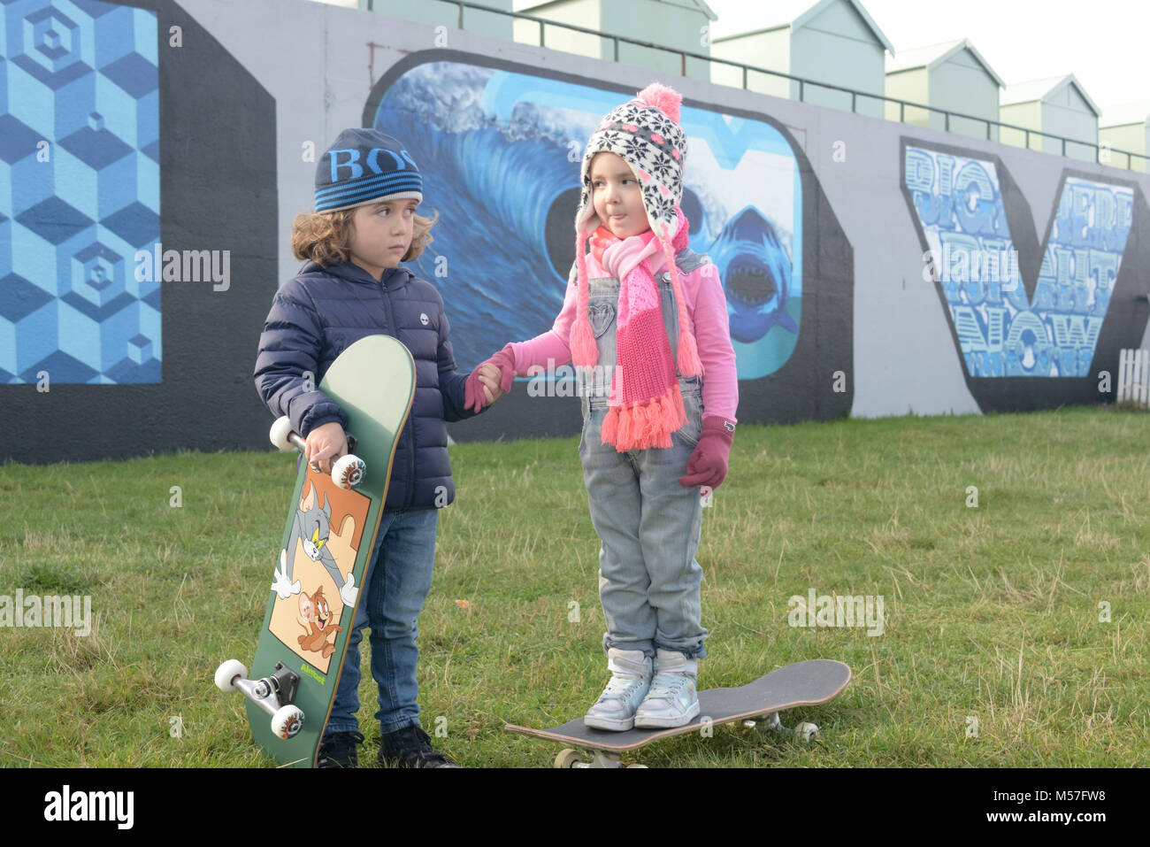 young kids are having fun at a skatepark Stock Photo - Alamy