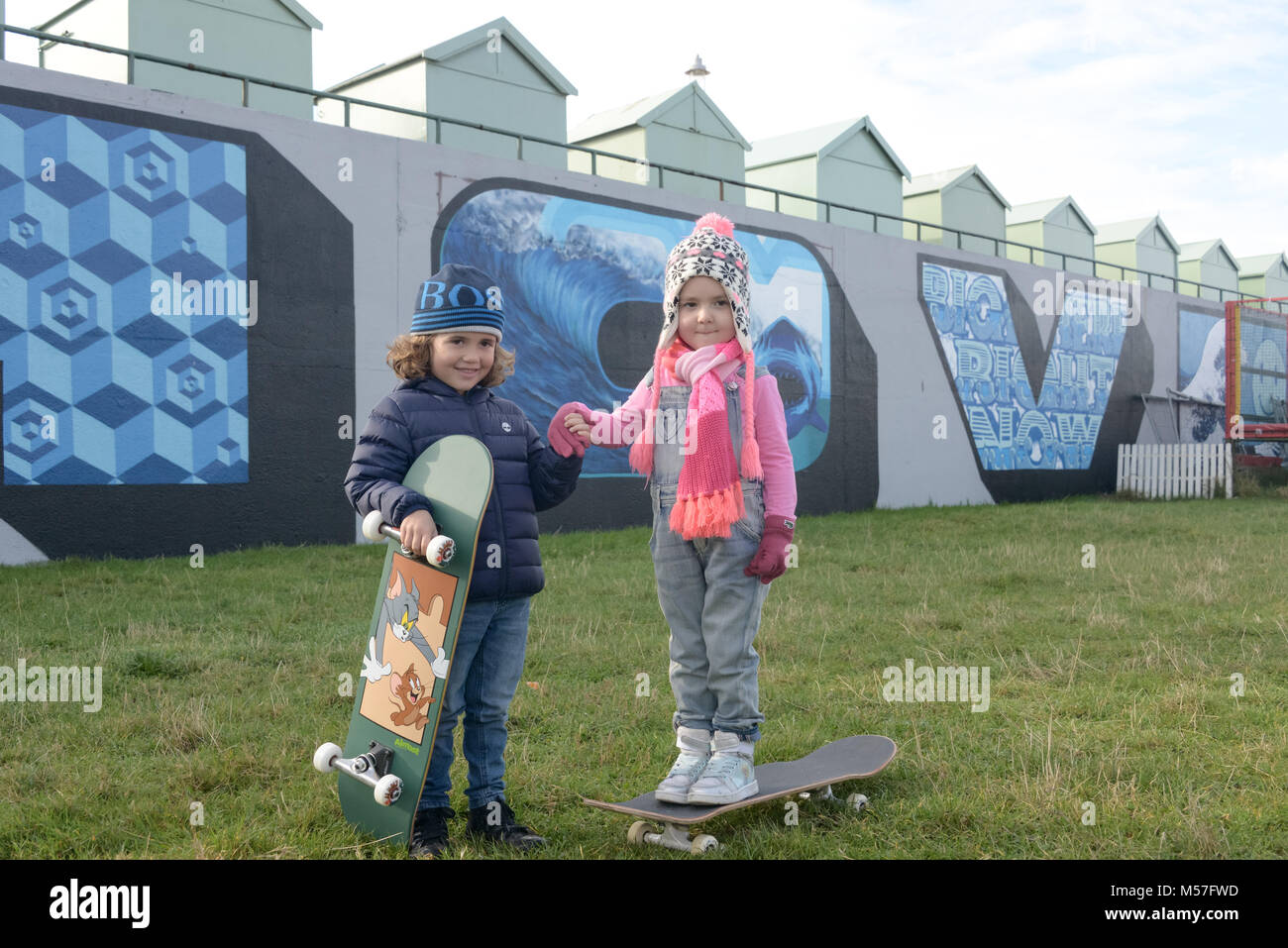 young kids are having fun at a skatepark Stock Photo - Alamy