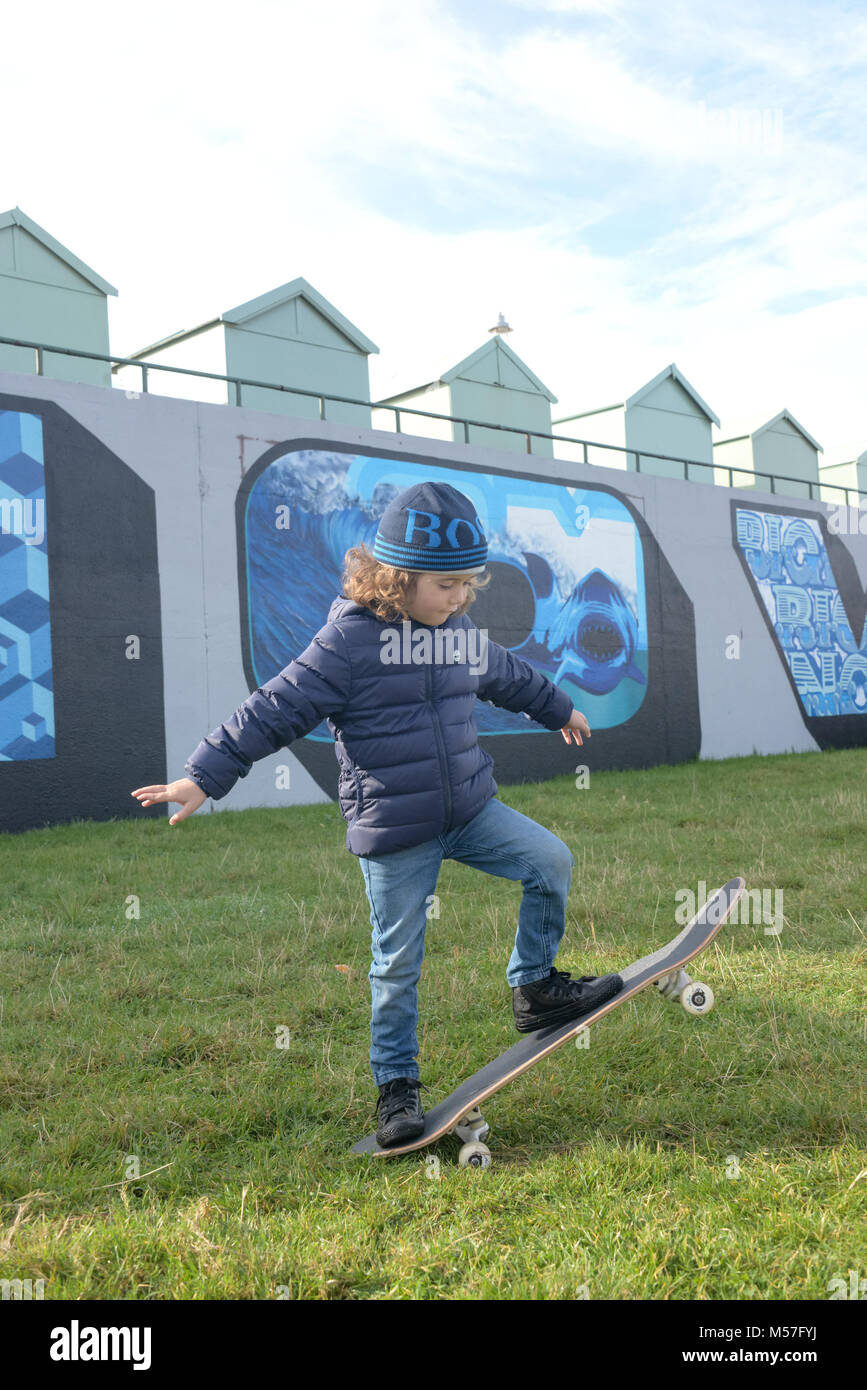 young kids are having fun at a skatepark Stock Photo - Alamy