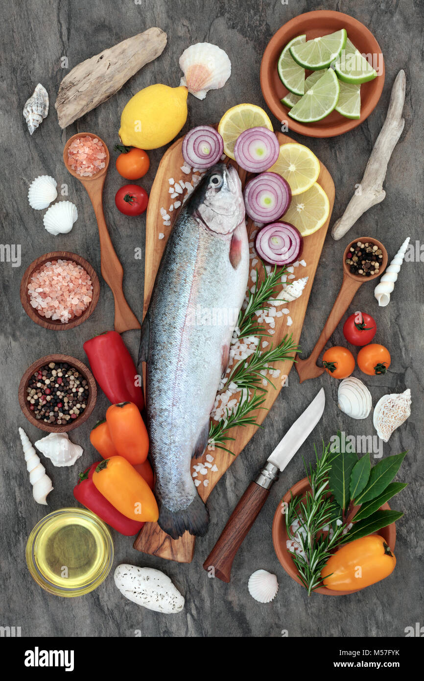 Healthy heart food with rainbow trout fish, seasoning, herbs ...