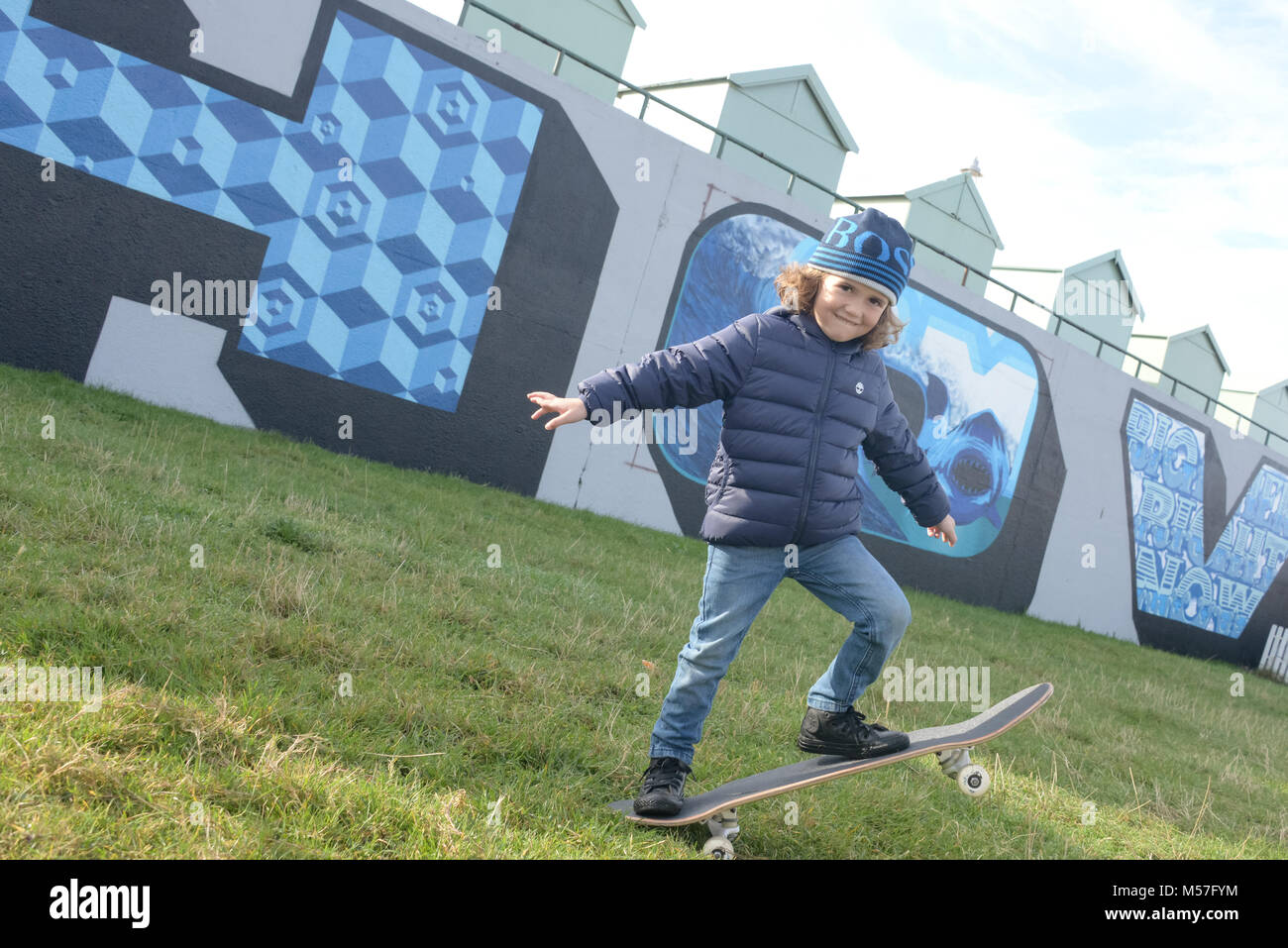 young kids are having fun at a skatepark Stock Photo - Alamy