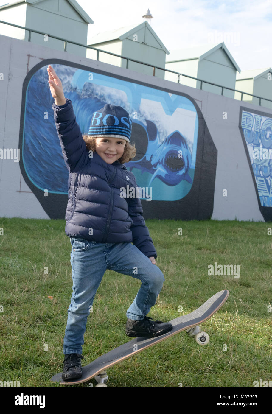 young kids are having fun at a skatepark Stock Photo - Alamy
