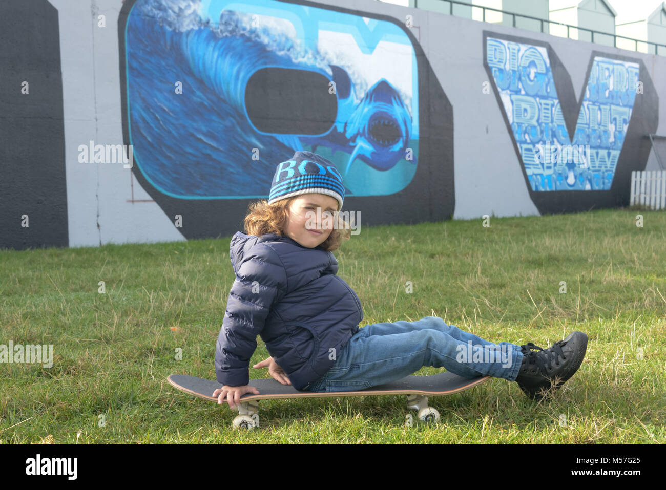 young kids are having fun at a skatepark Stock Photo - Alamy