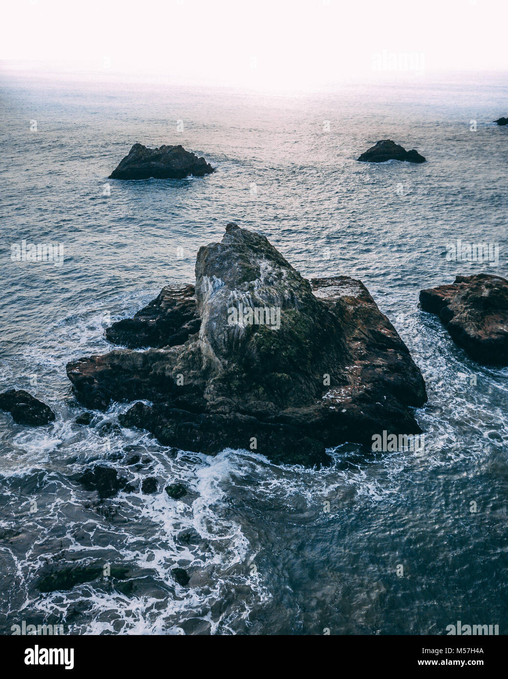 Lone rock in the water on the California coastline Stock Photo - Alamy