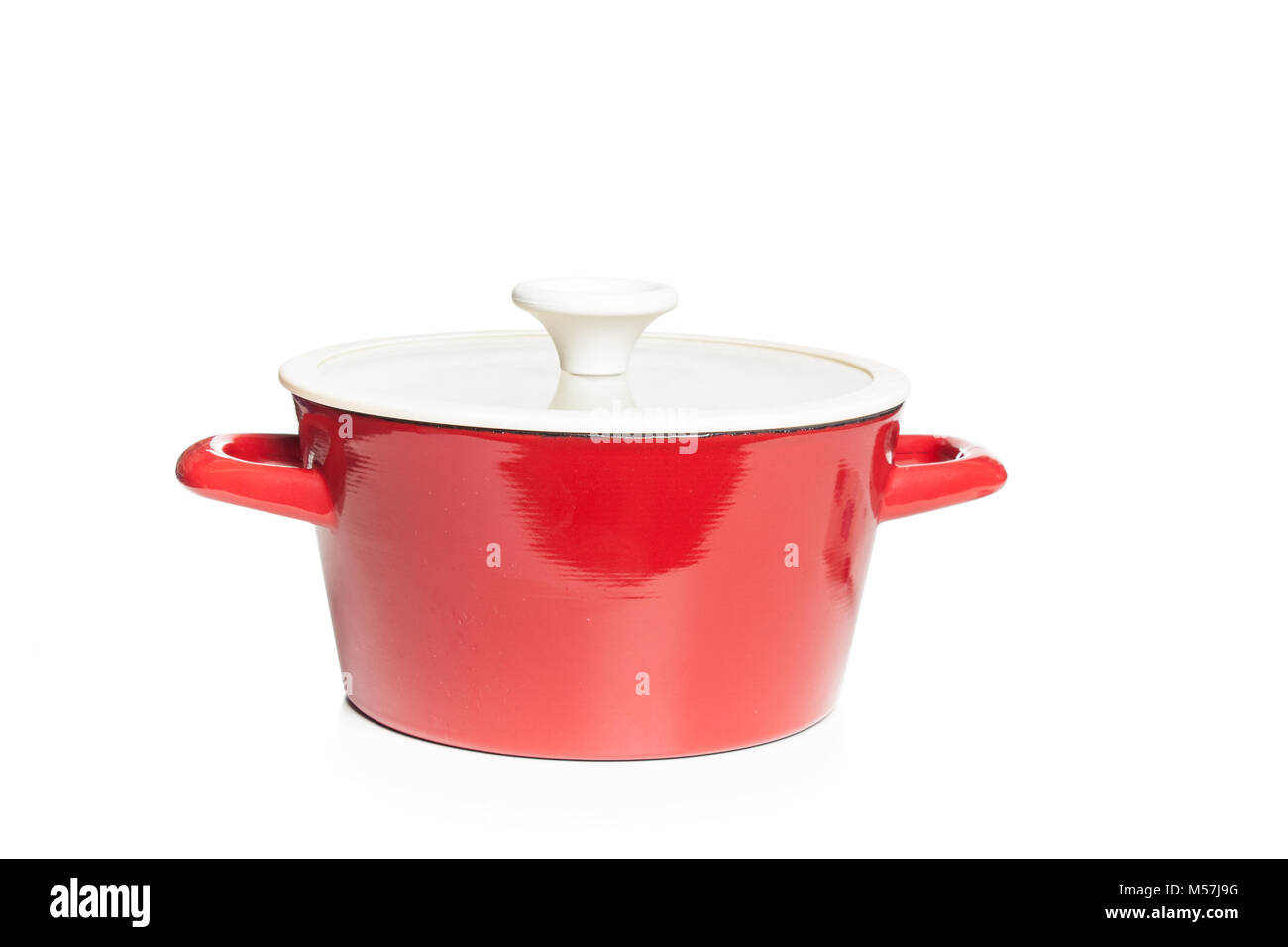 Red cast iron cooking pot, isolated on white background Stock Photo - Alamy