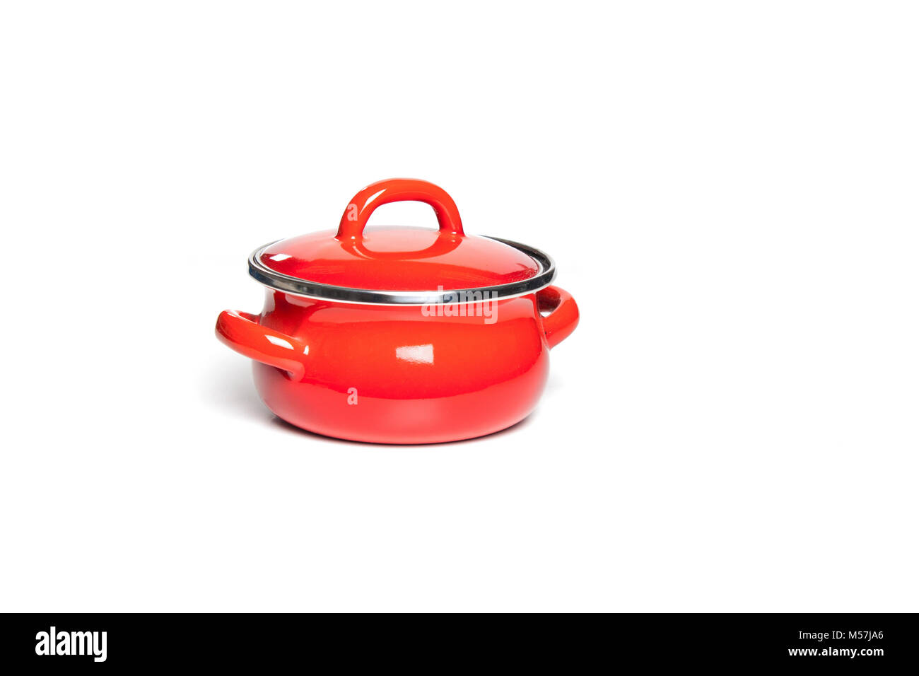 Red cast iron cooking pot, isolated on white background Stock Photo - Alamy
