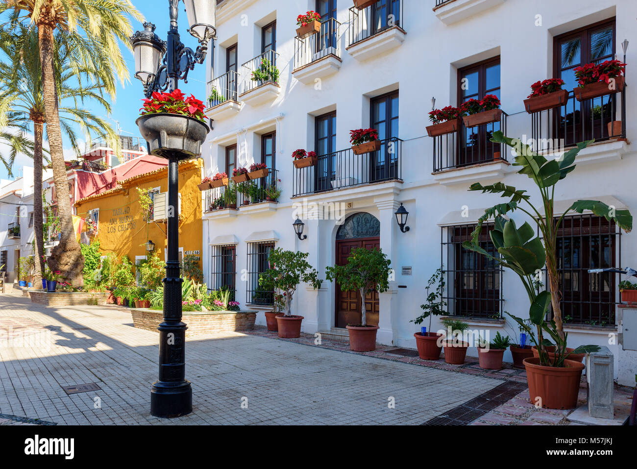Street with beautiful facades, decorated with flower pots Stock Photo ...
