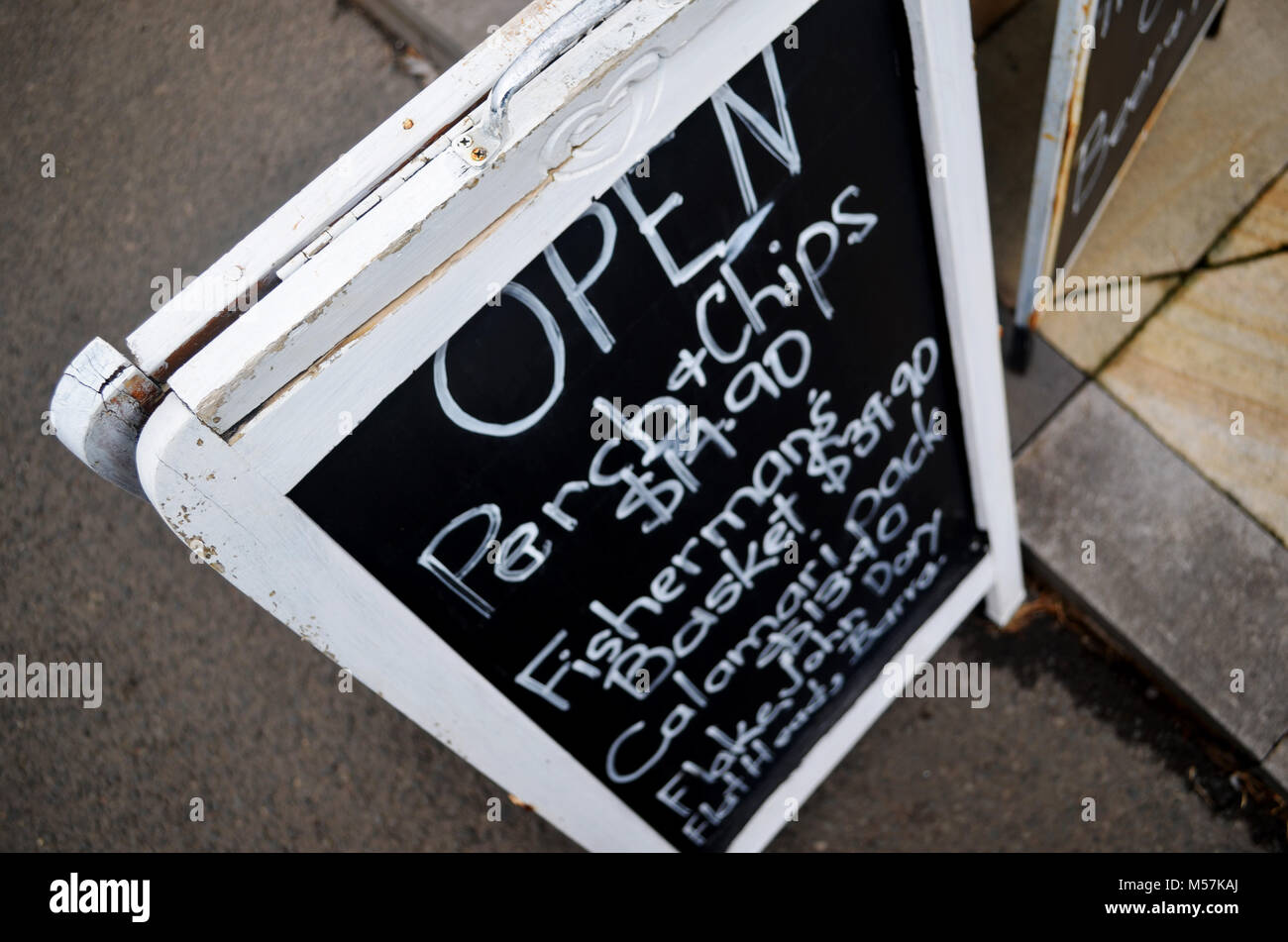Menu board outside fish cafe restaurant Stock Photo - Alamy