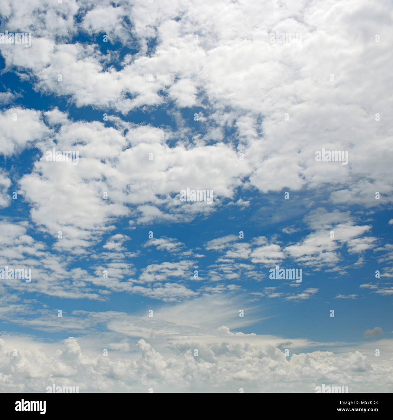 Bright white clouds on background of dark blue sky Stock Photo - Alamy