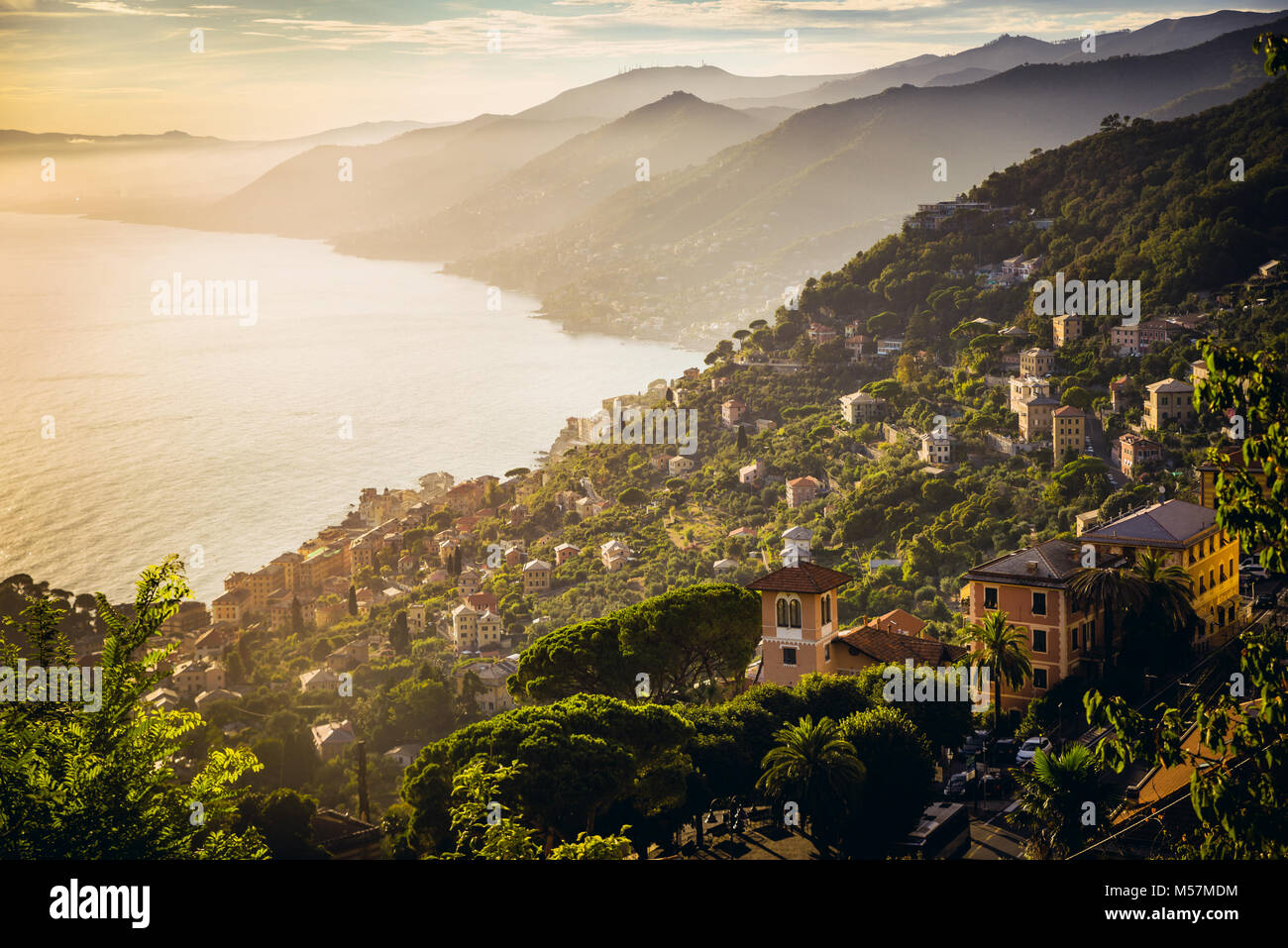 Beautiful sunset view of a village by the sea Stock Photo - Alamy