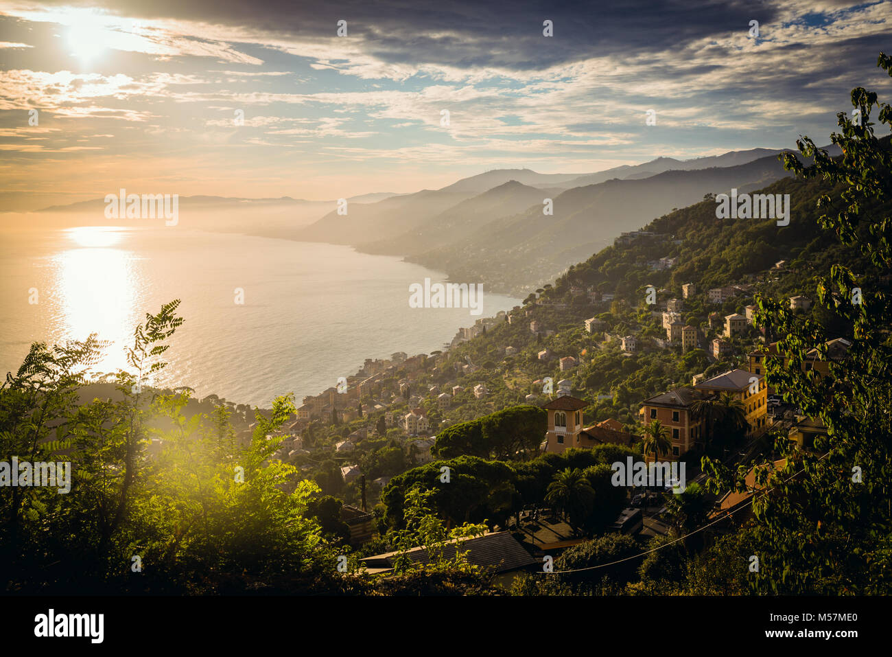 Beautiful sunset view of a village by the sea Stock Photo - Alamy