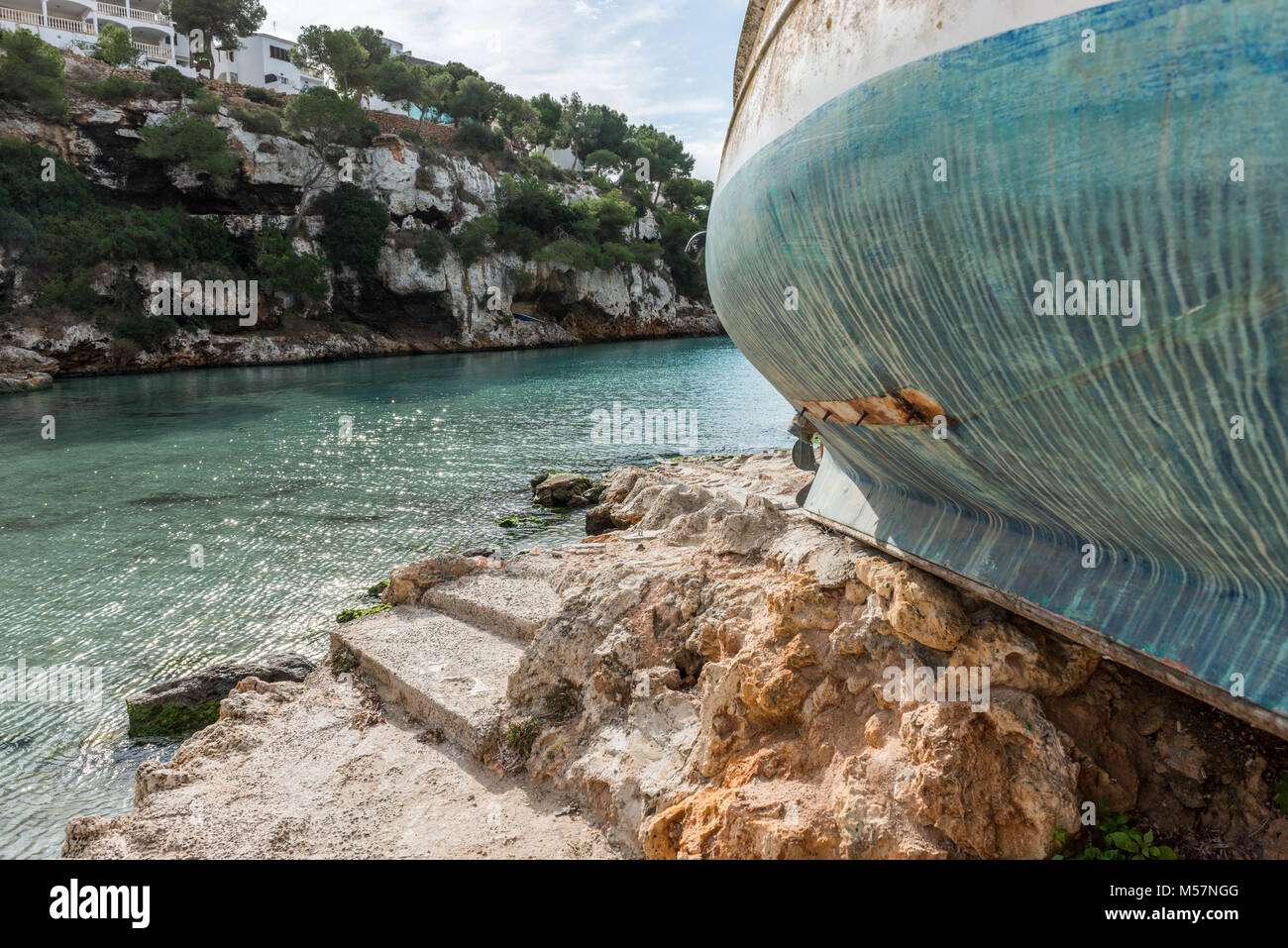 A fishing boat stranded in one of the shores of Cala Pi on the Island ...