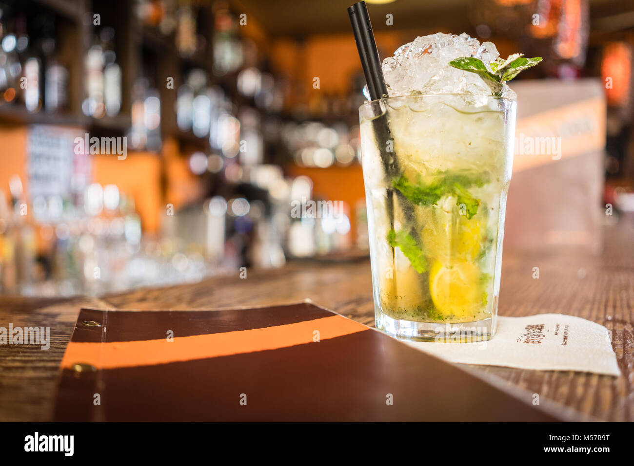 Mojito cocktail and menu on counter of bar Stock Photo - Alamy