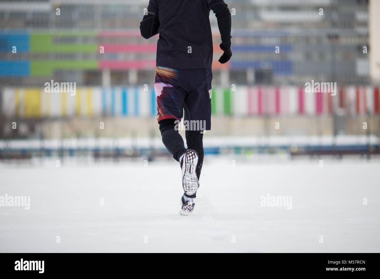Picture from back of running athlete at stadium Stock Photo - Alamy