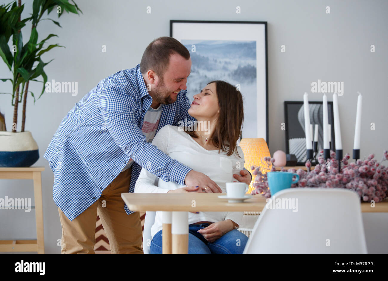 Photo of happy hugging married couple Stock Photo - Alamy