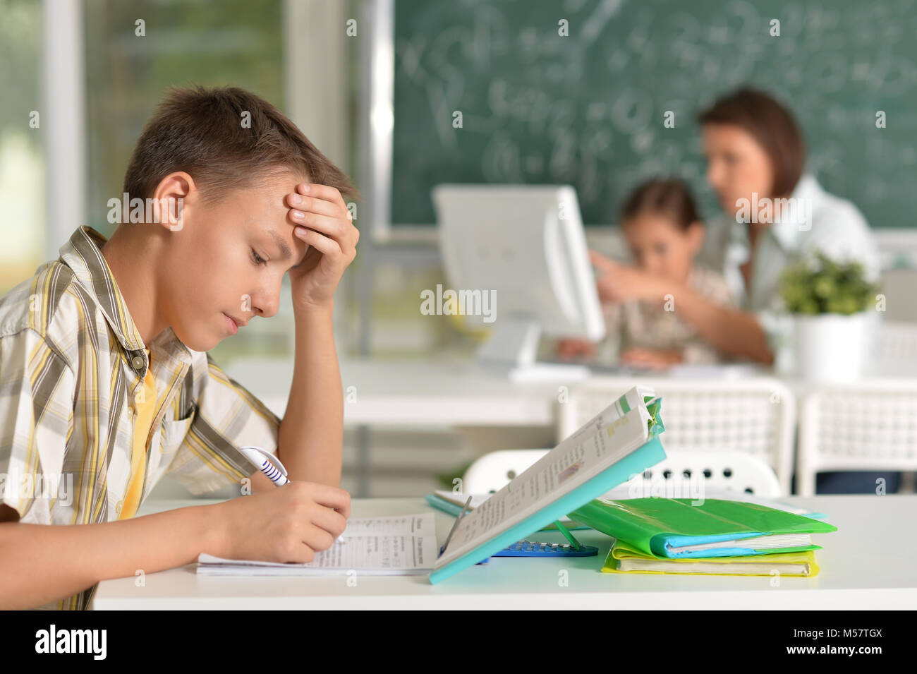 Pupil studying lessons Stock Photo - Alamy