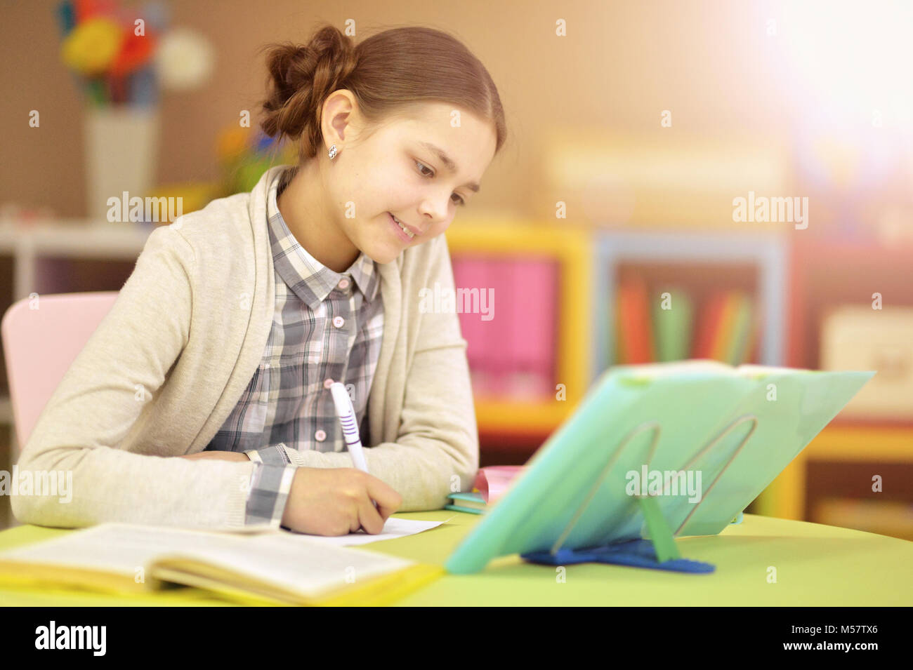 schoolgirl doing homework Stock Photo - Alamy