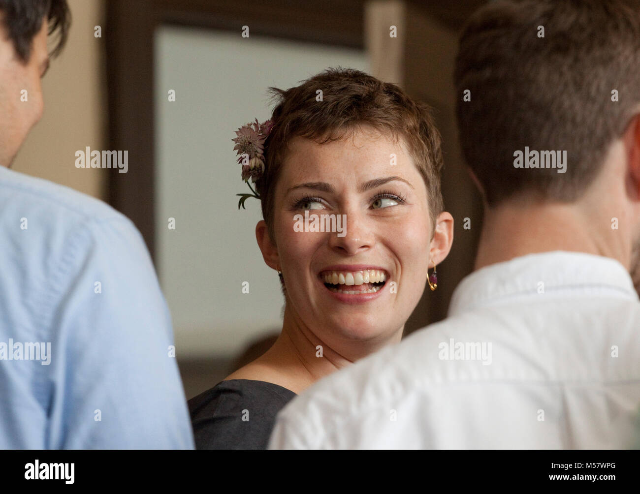 A pretty young woman looks sideways Stock Photo - Alamy