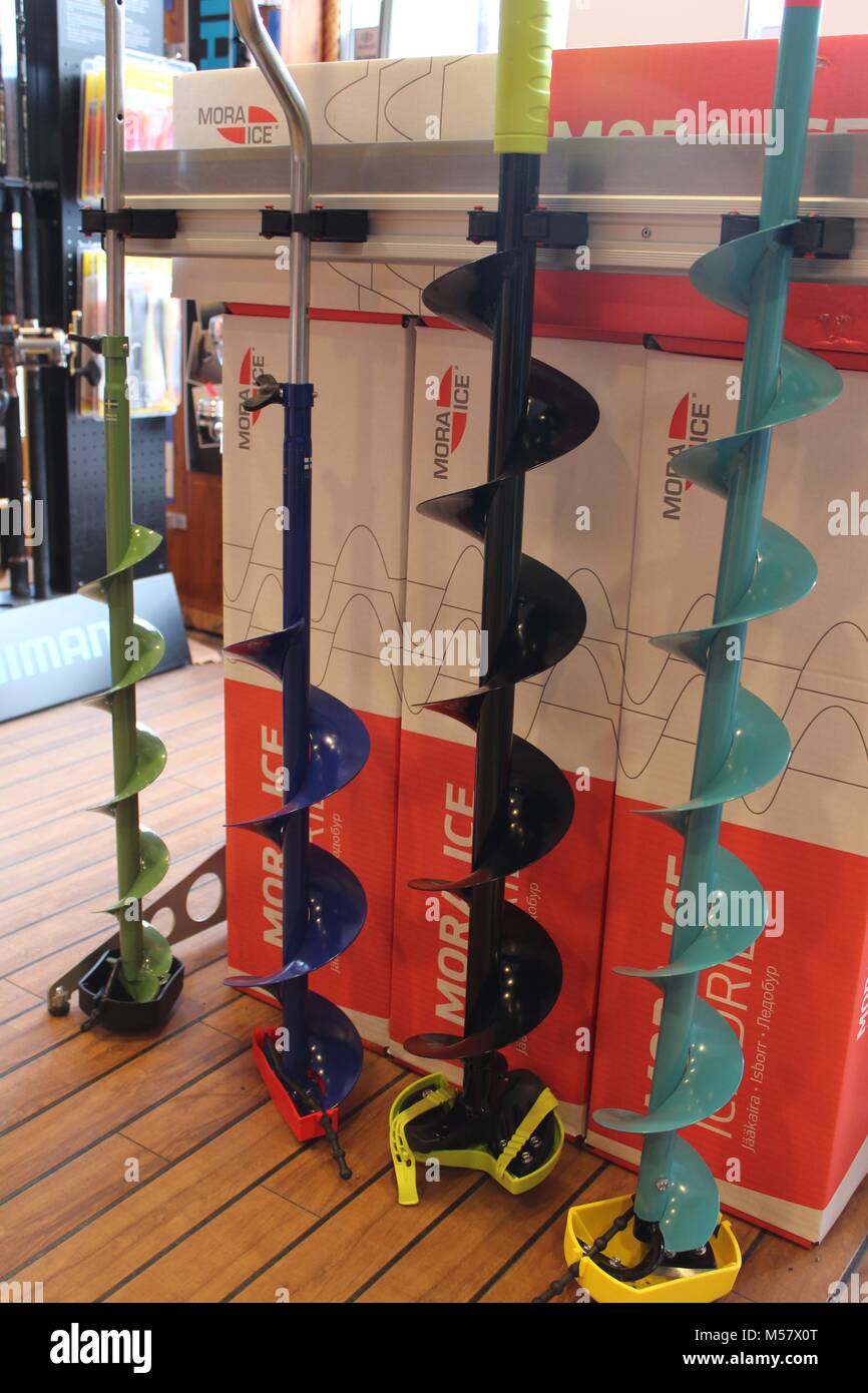 Shop display of four large drills used to drill into ice to go fishing ...
