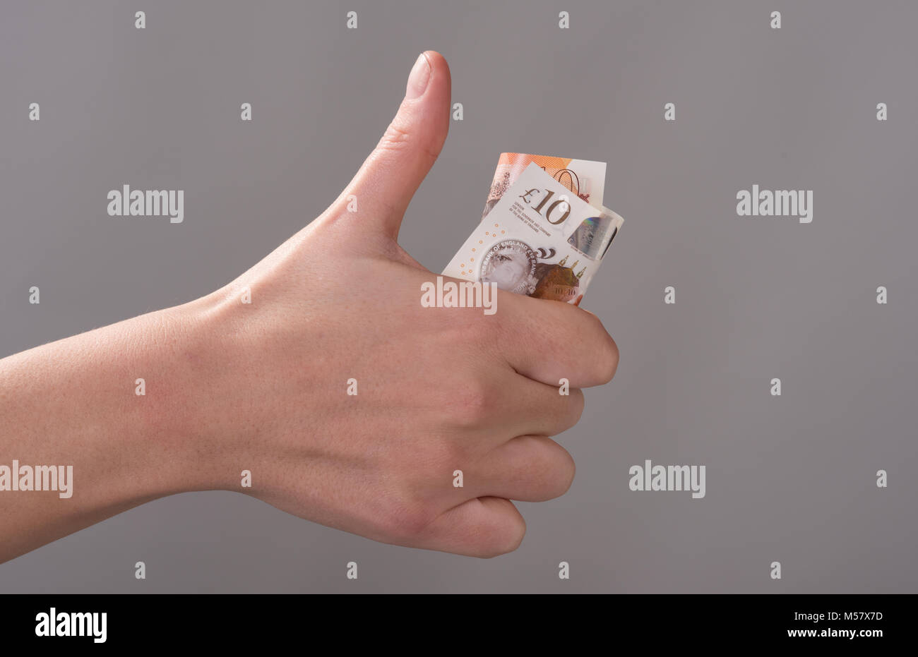 Thumbing a lift with an offer of money Stock Photo - Alamy