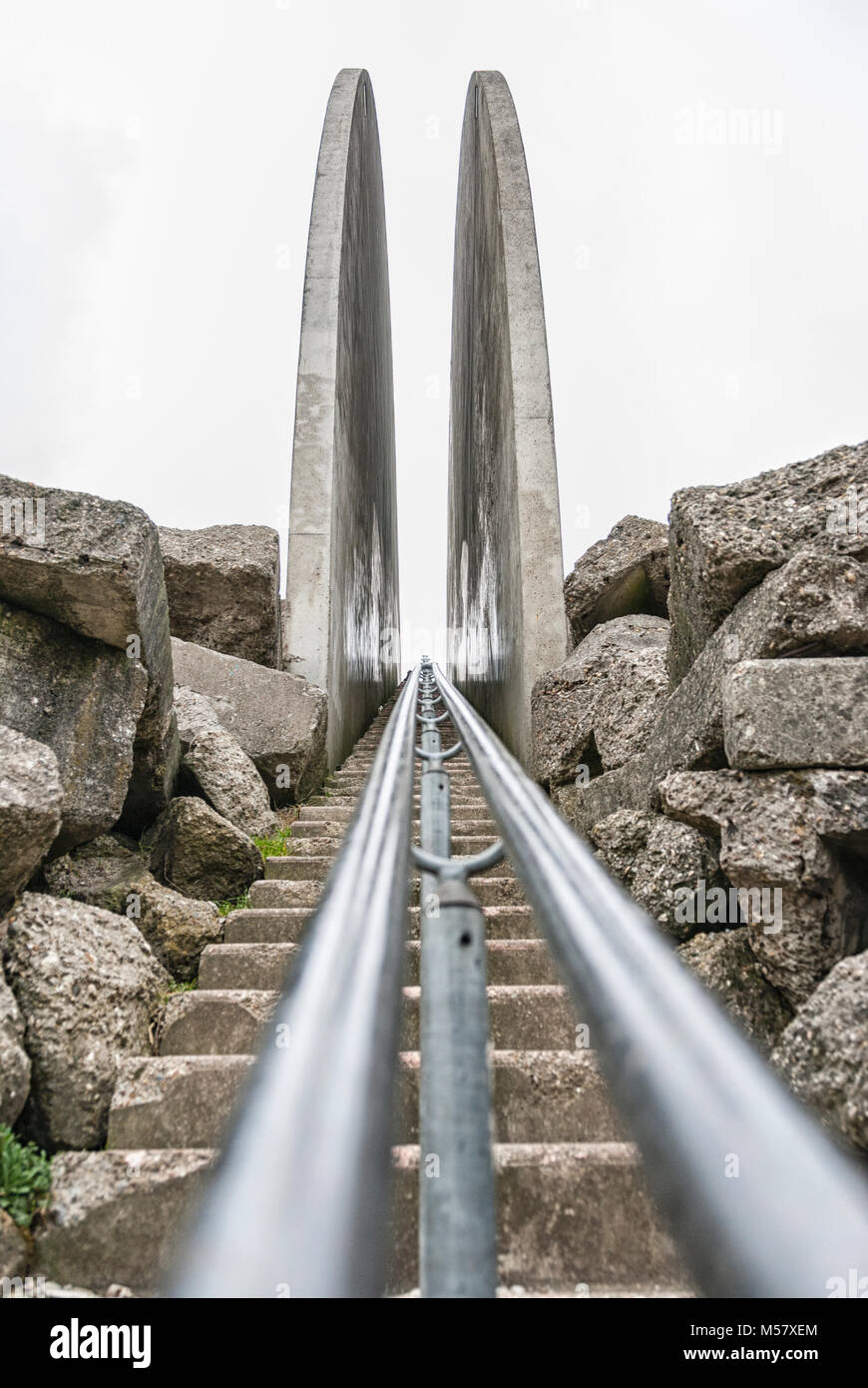 point of view of a concrete monument with steps surrounded by concrete ...