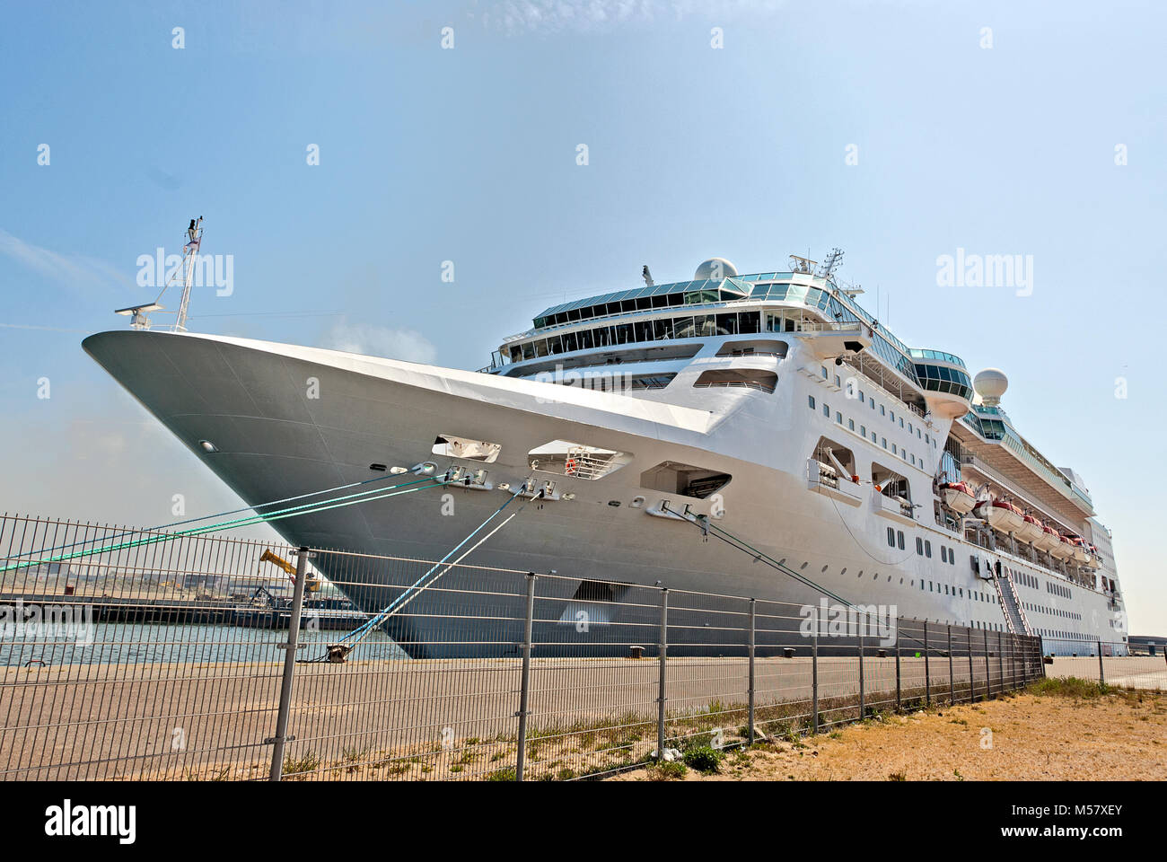 cruise ship docked with the mooring lines attached to the quay Stock ...