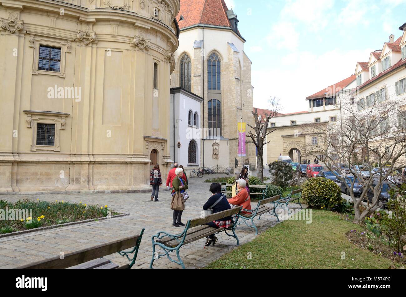 People at a plaza next to the mausoleum in Graz, the capital of federal ...