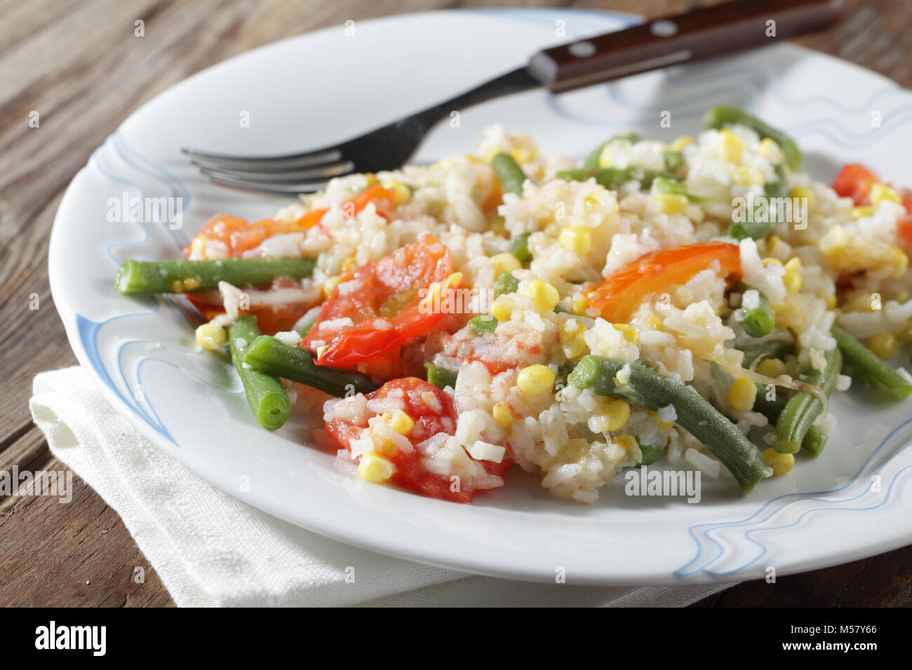 Rice with vegetables on a plate closeup Stock Photo - Alamy