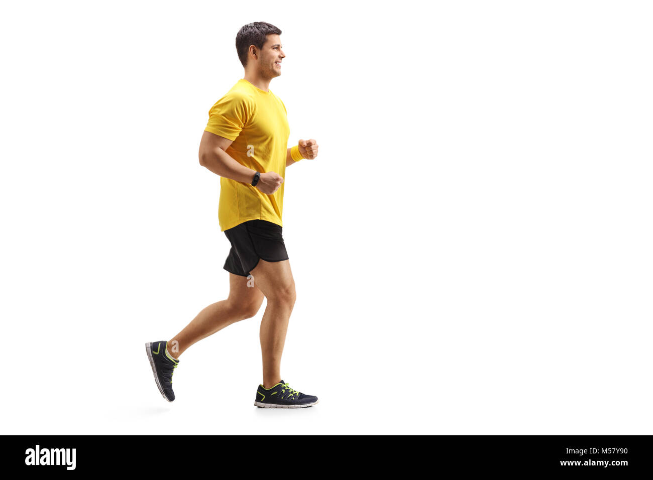 Full length profile shot of a young man running isolated on white ...