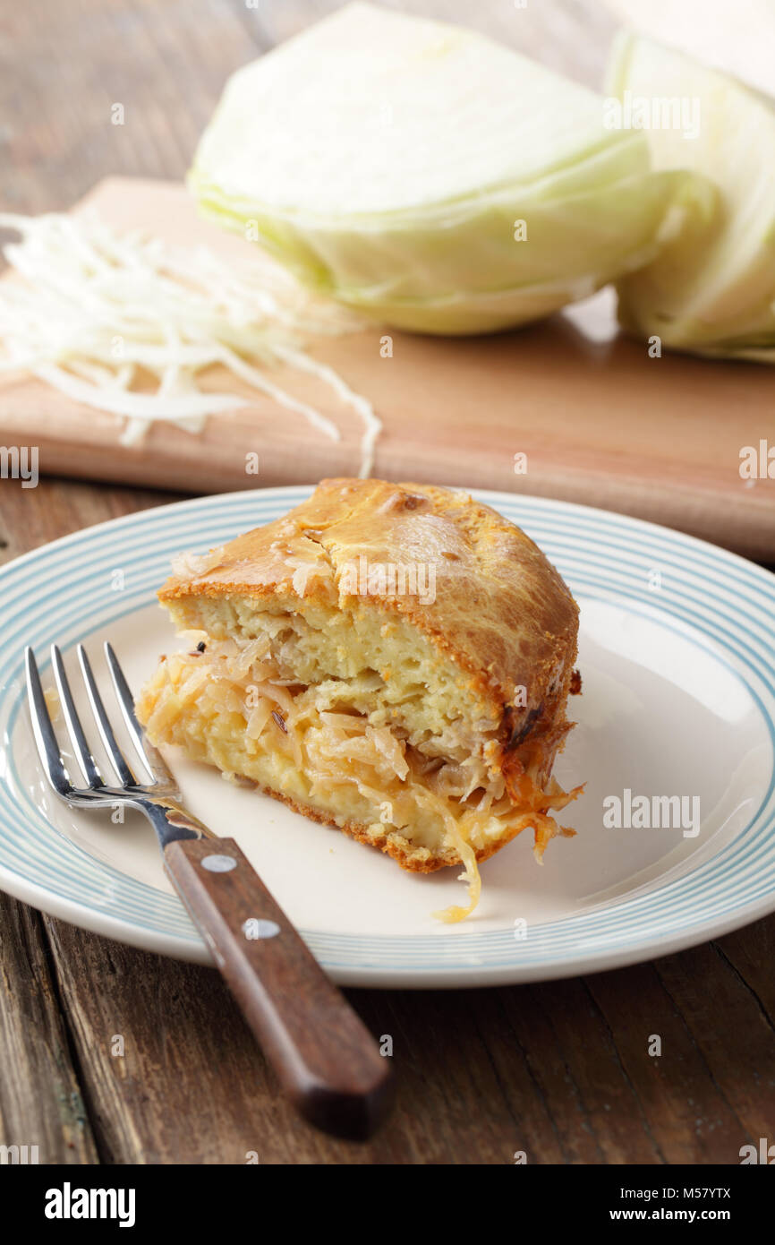 Slice of Russian traditional cabbage pie on a plate Stock Photo - Alamy