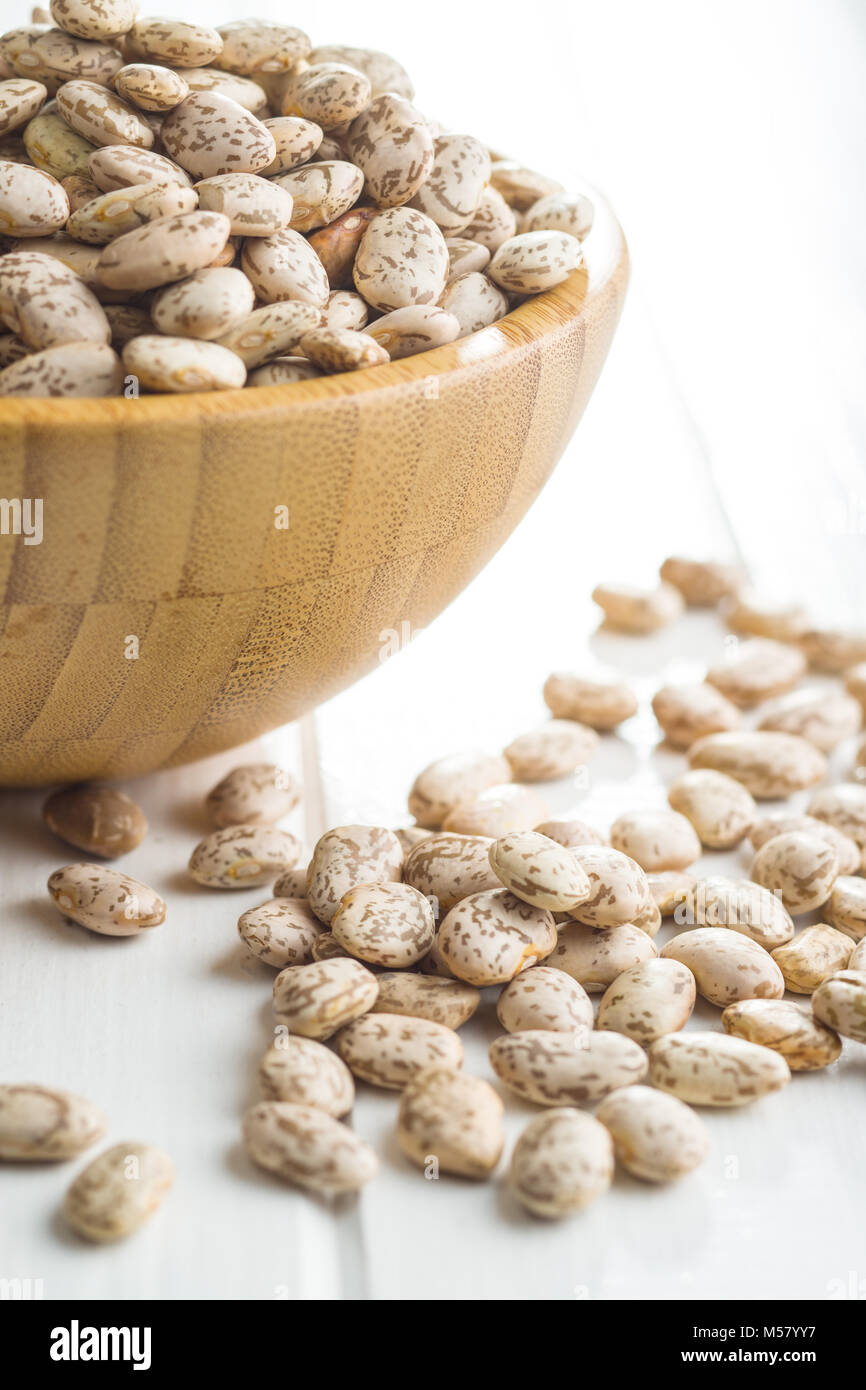 Dried borlotti beans on white table Stock Photo - Alamy