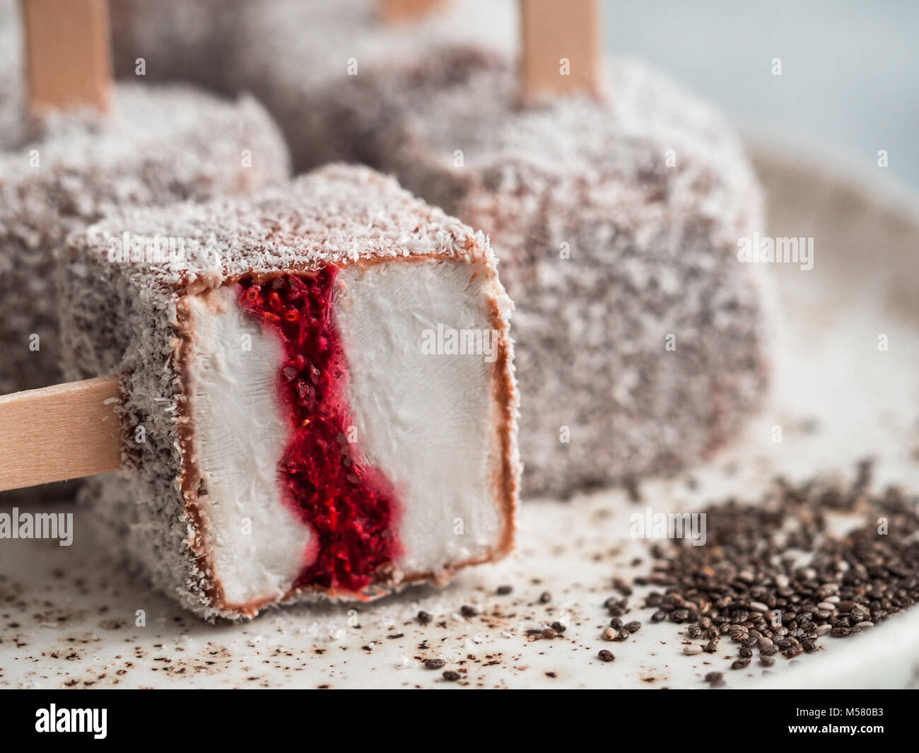 Homemade raw lamington ice cream pops on light background. Australian ...