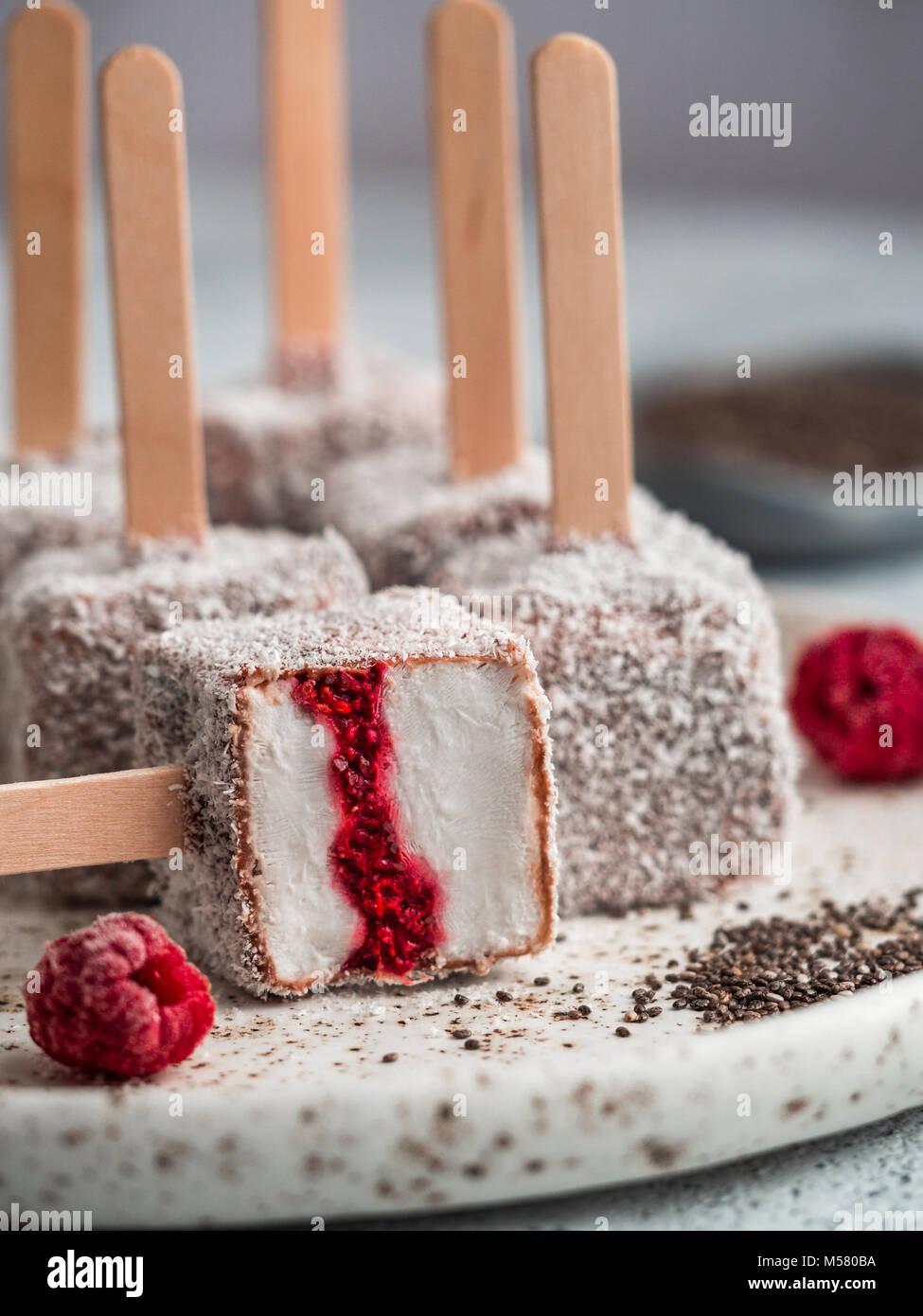 Homemade raw lamington ice cream pops on light background. Australian ...
