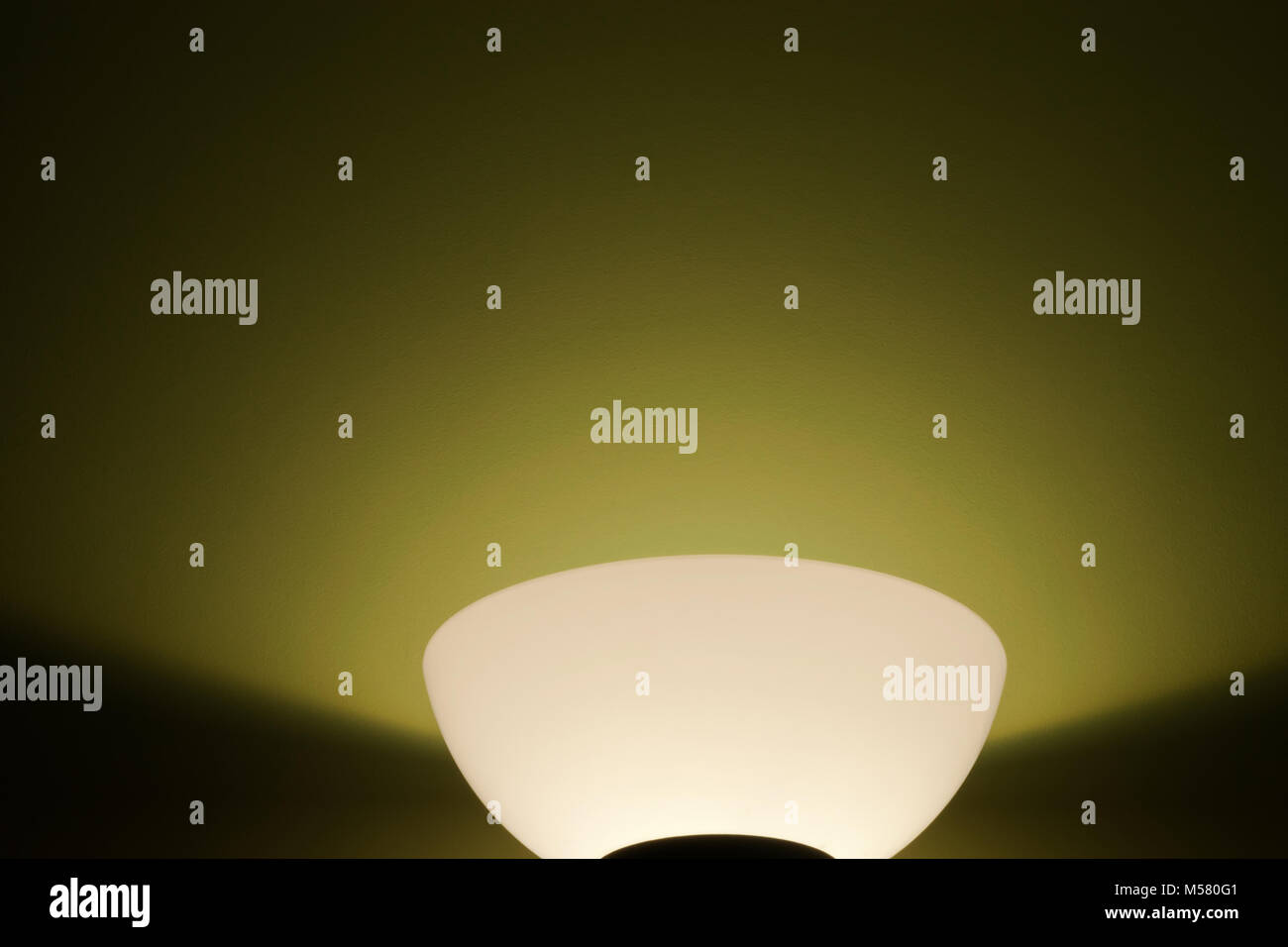 Lamp reflecting light into the green wall. Very romantic atmosphere ...