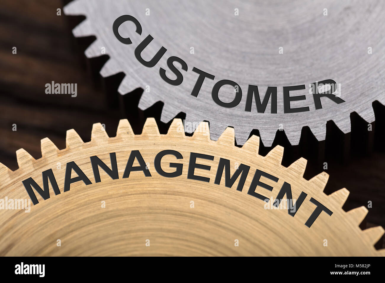 Closeup of customer management concept on interlocked cogwheels Stock ...
