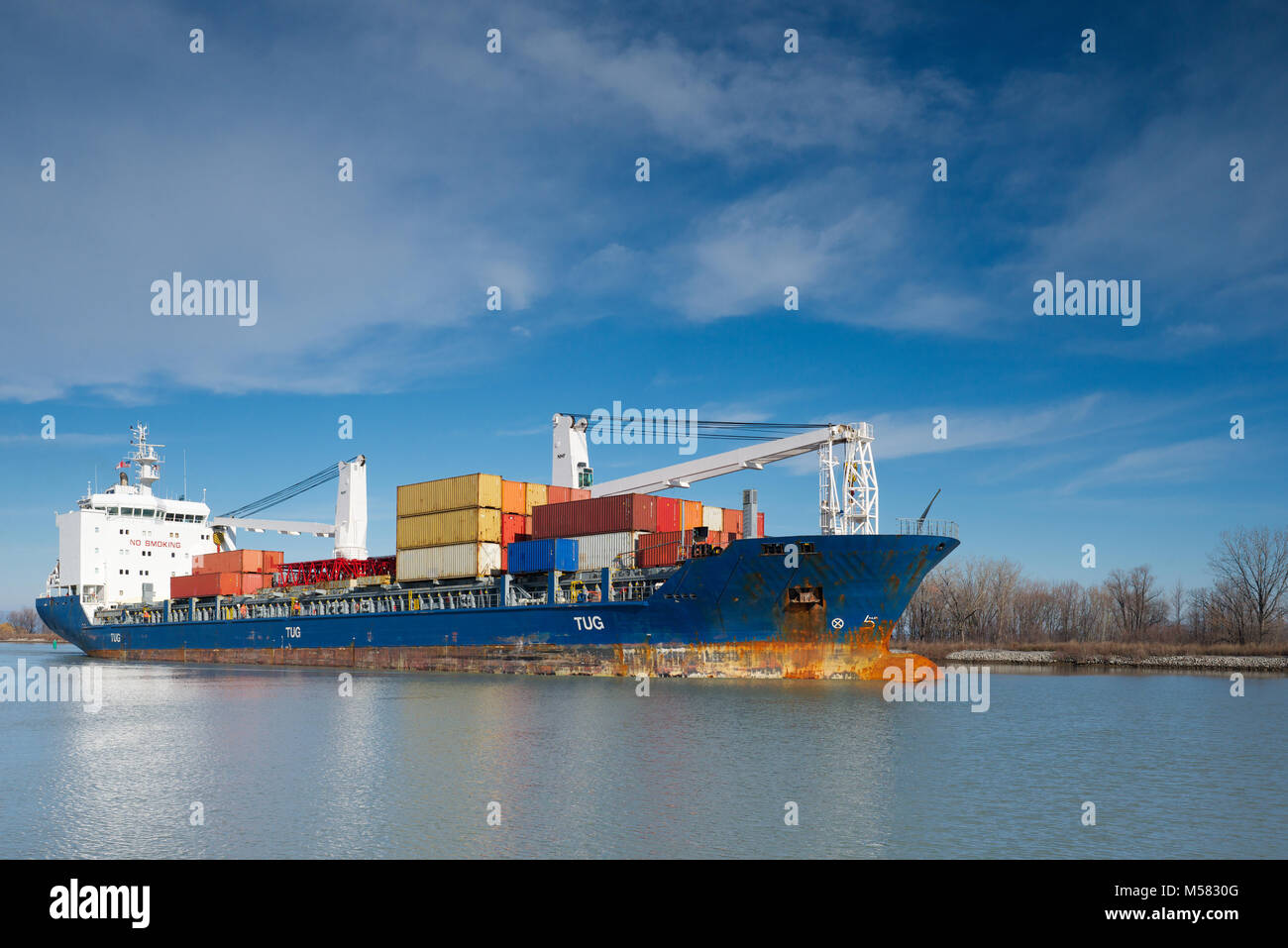 A container ship passing through the Welland Canal, Ontario, Canada ...