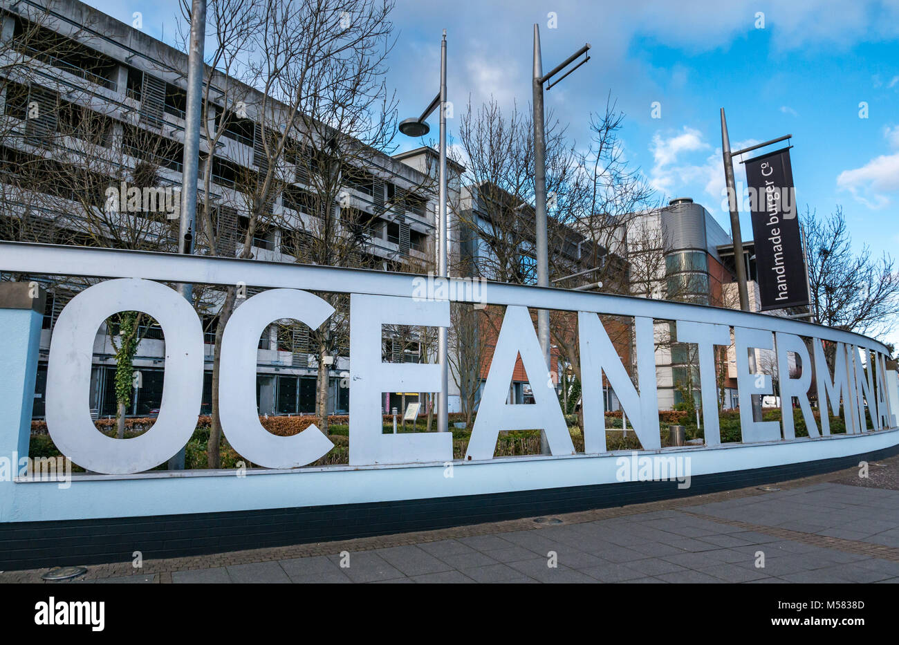 Ocean Terminal name in large curved letters outside the shopping Mall ...