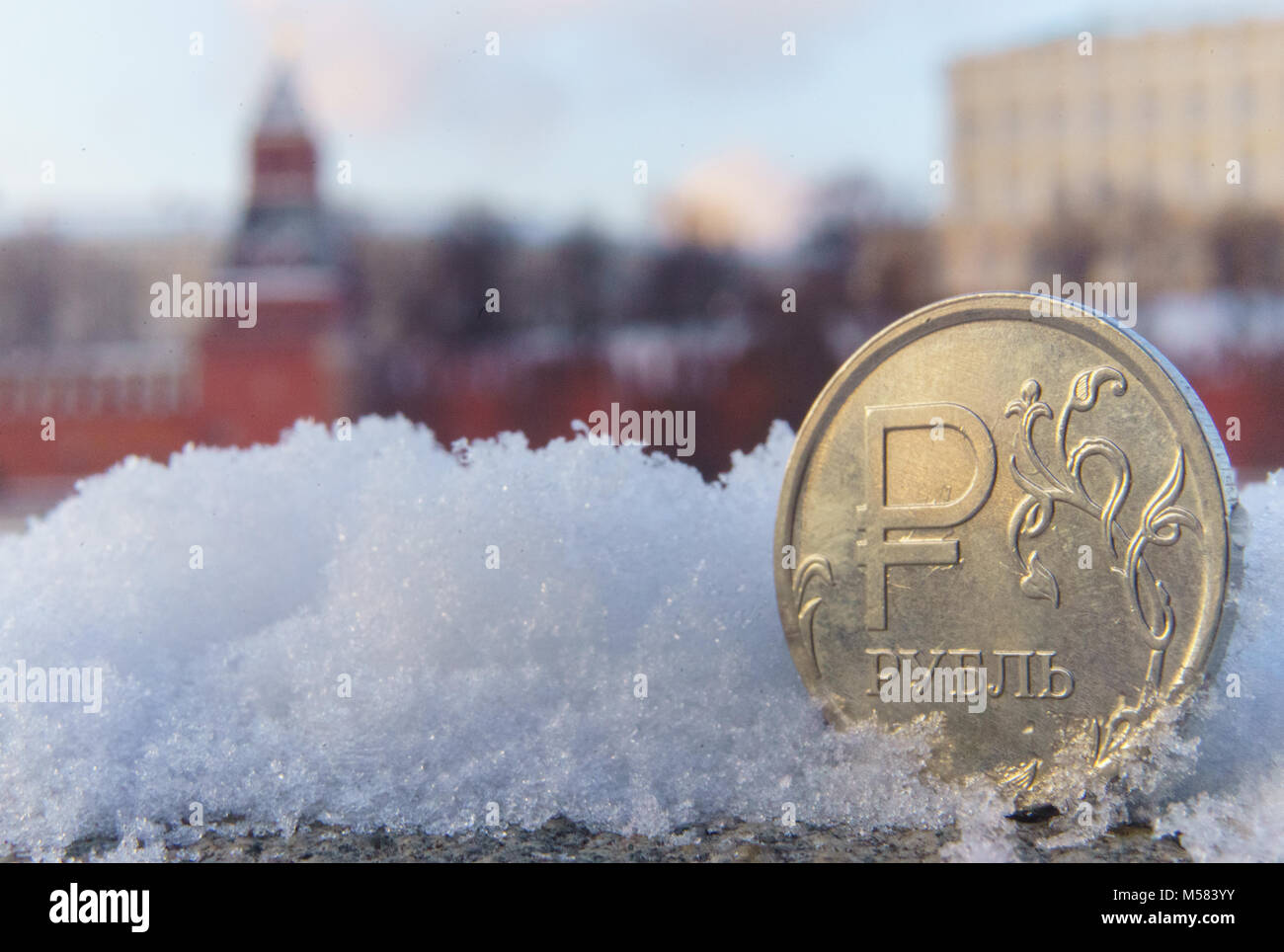 A coin worth one Russian ruble against the backdrop of the Moscow ...