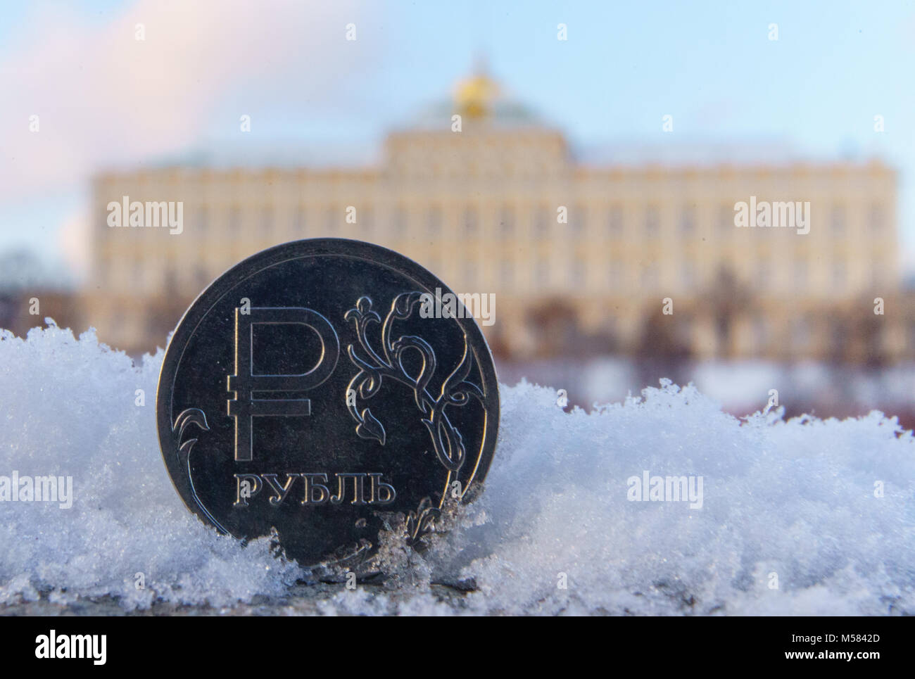 A coin worth one Russian ruble against the backdrop of the Moscow ...