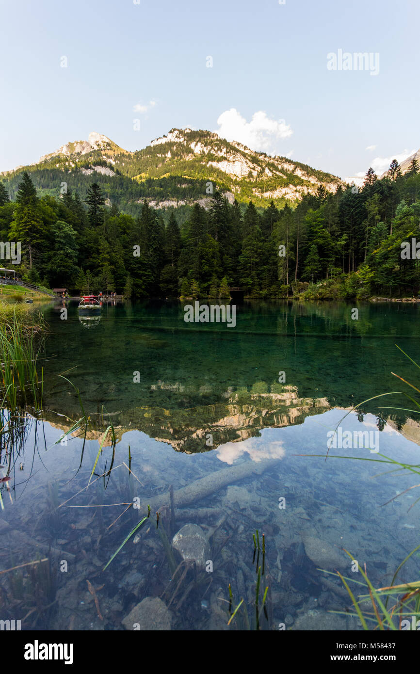 Lake Blausee in the beautiful country of Switzerland in the Swiss alps ...